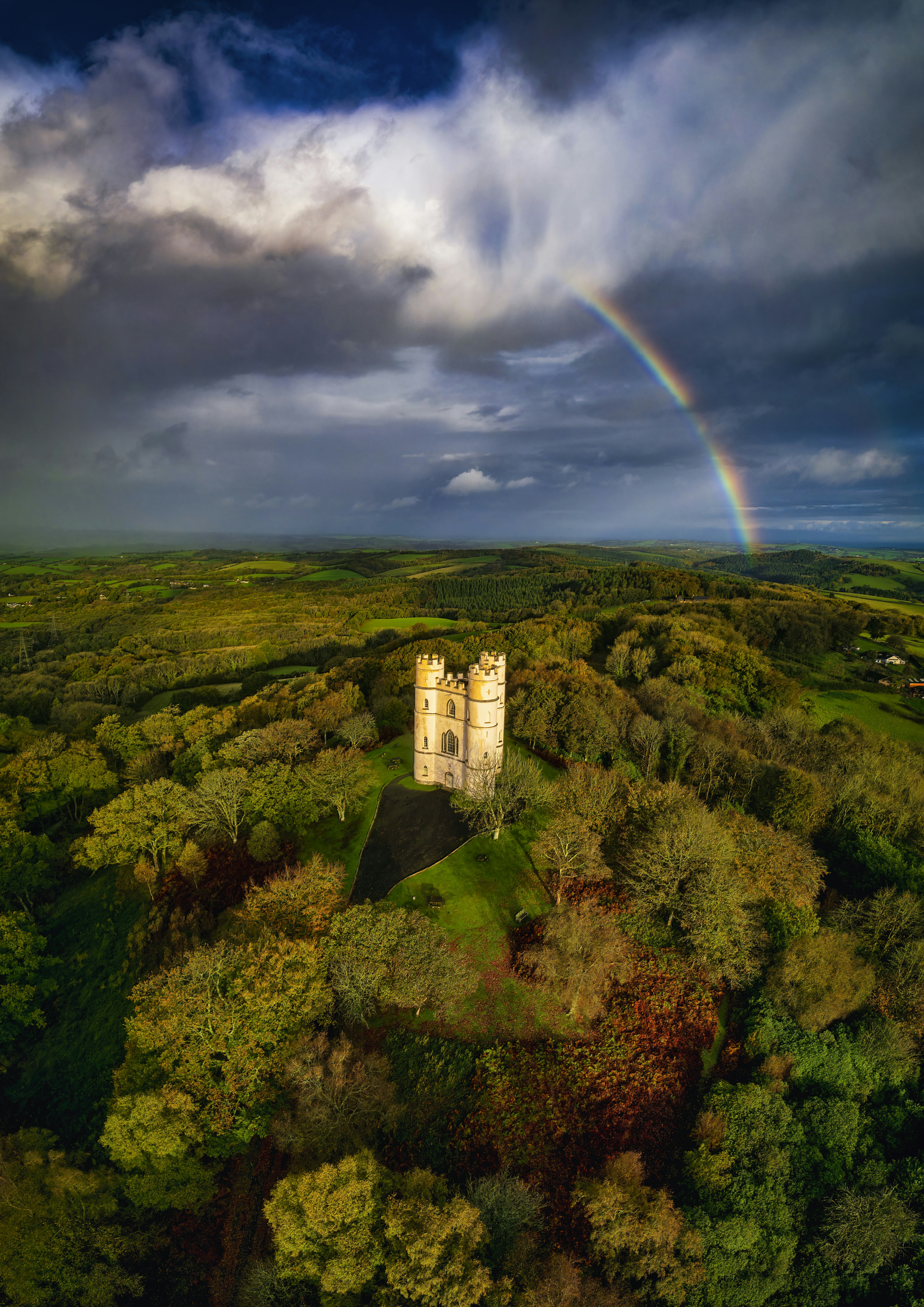 Verdant Hilltop Keep Under a Ribbon of Rainbow