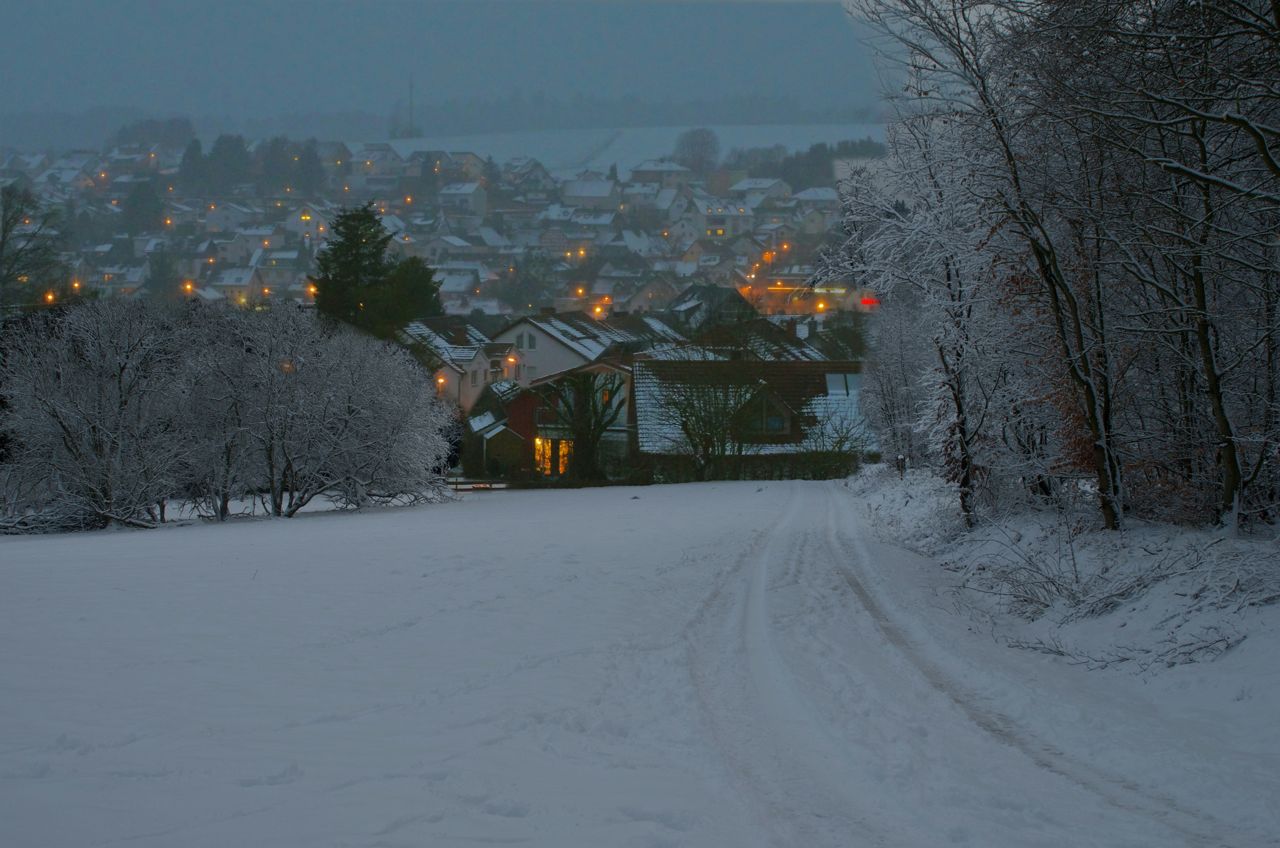 Amber Windows at Dusk: A Snowbound Hamlet