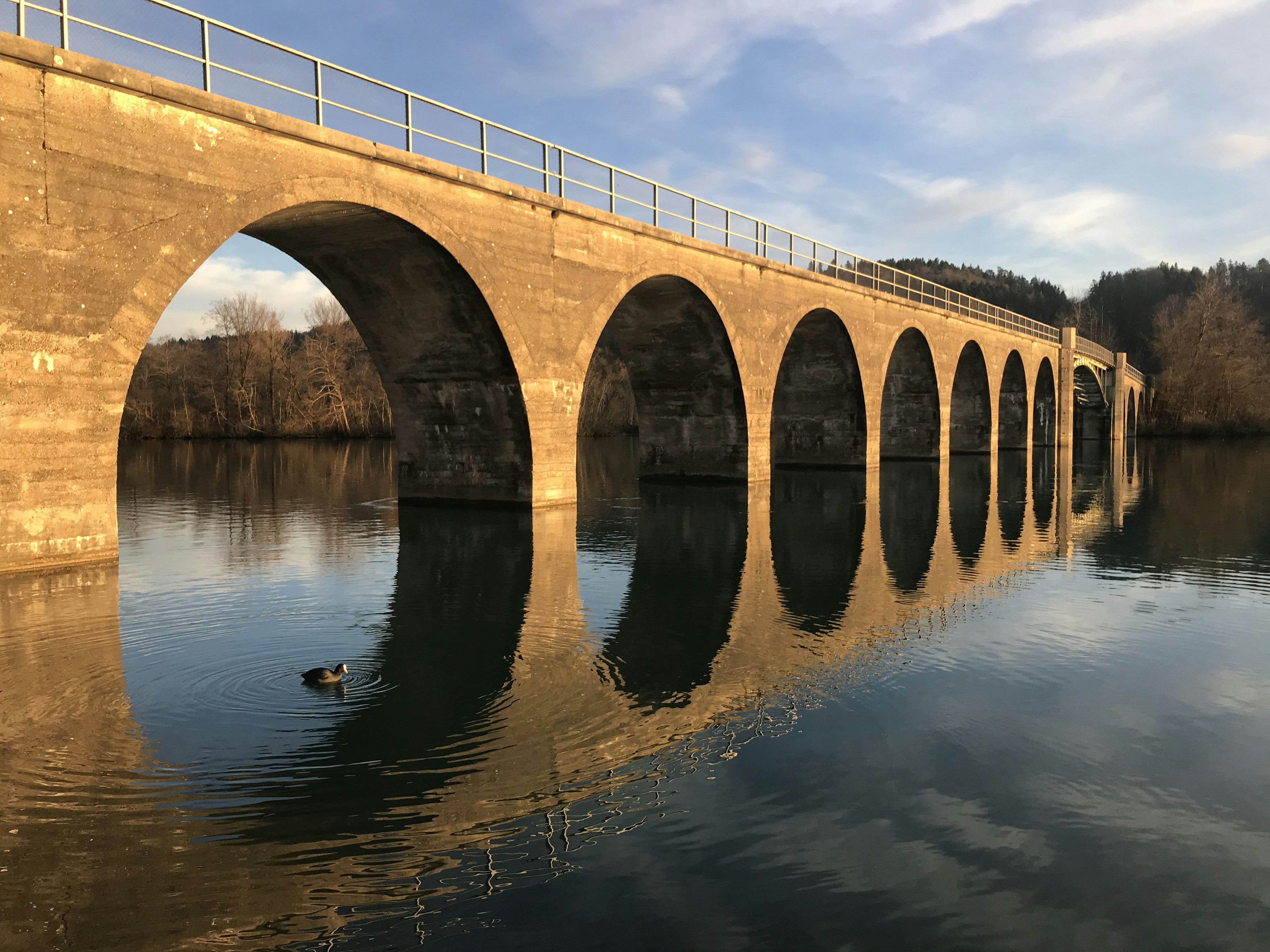 A bridge over a body of water photo – Free Reflected bridge Image on ...