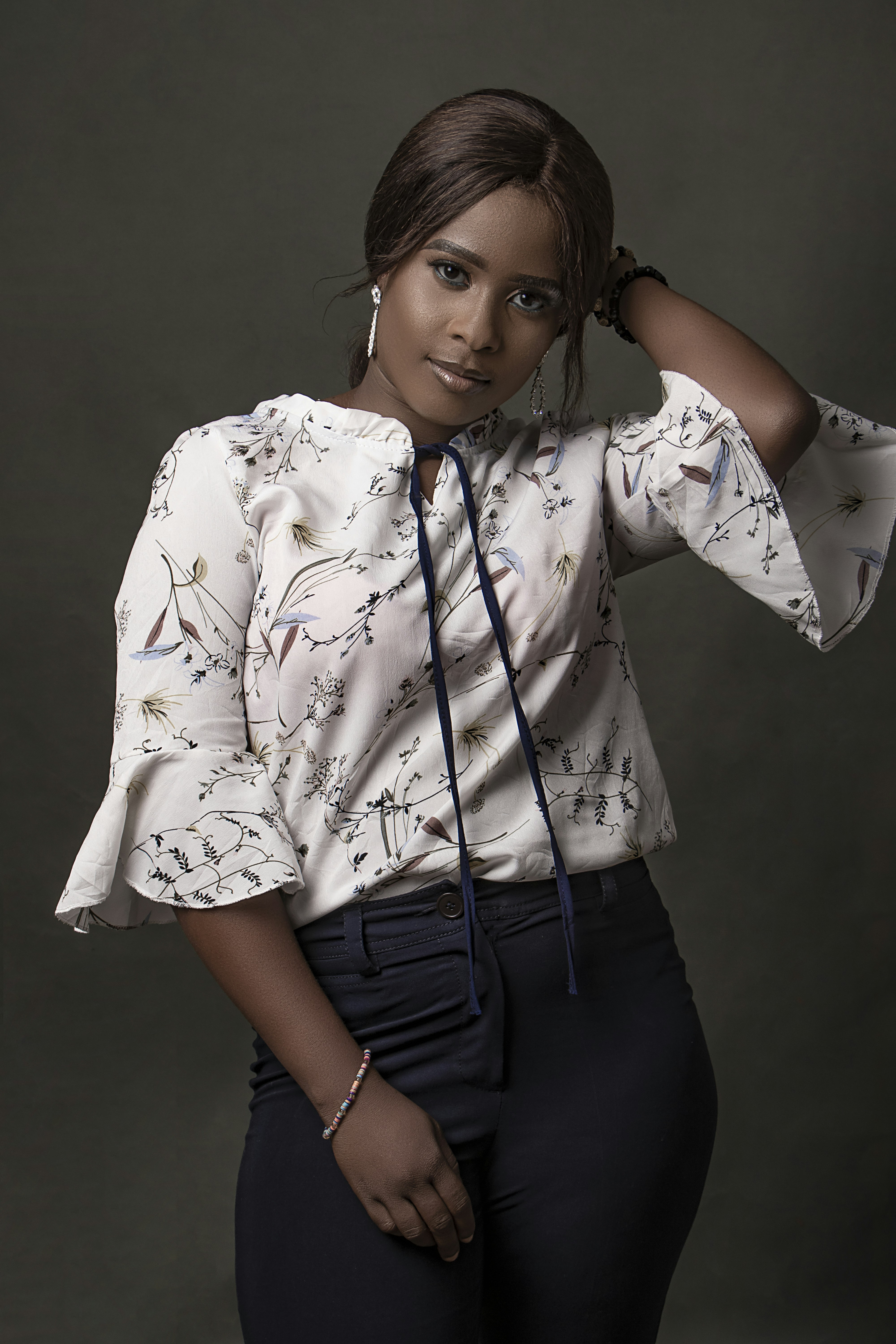 Graceful Poise: Portrait of Confidence in a Floral Top