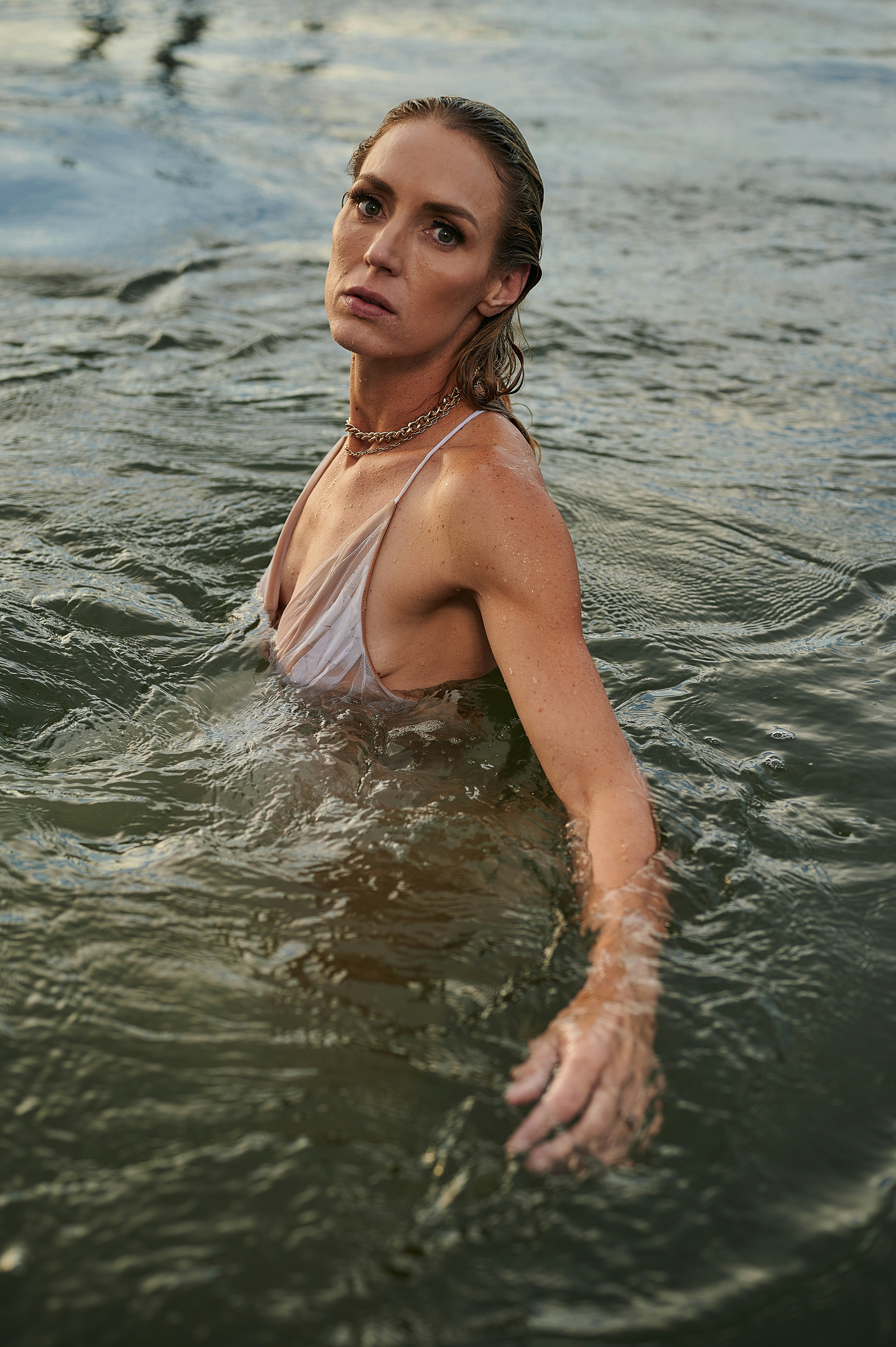 A woman in a garment in water photo – Free Vilano beach Image on Unsplash