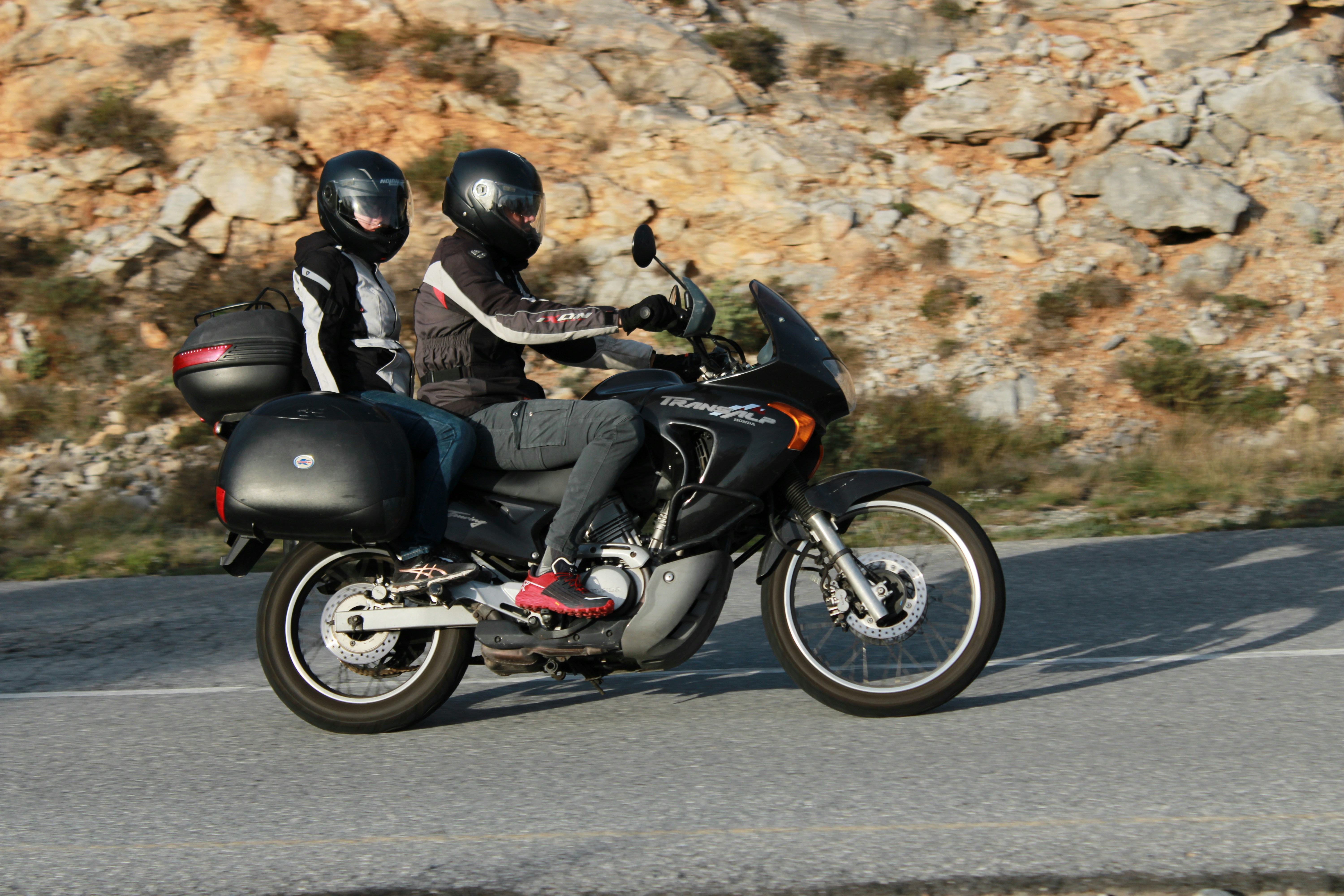 A couple of people ride on a motorcycle photo – Free Toirano Image on ...