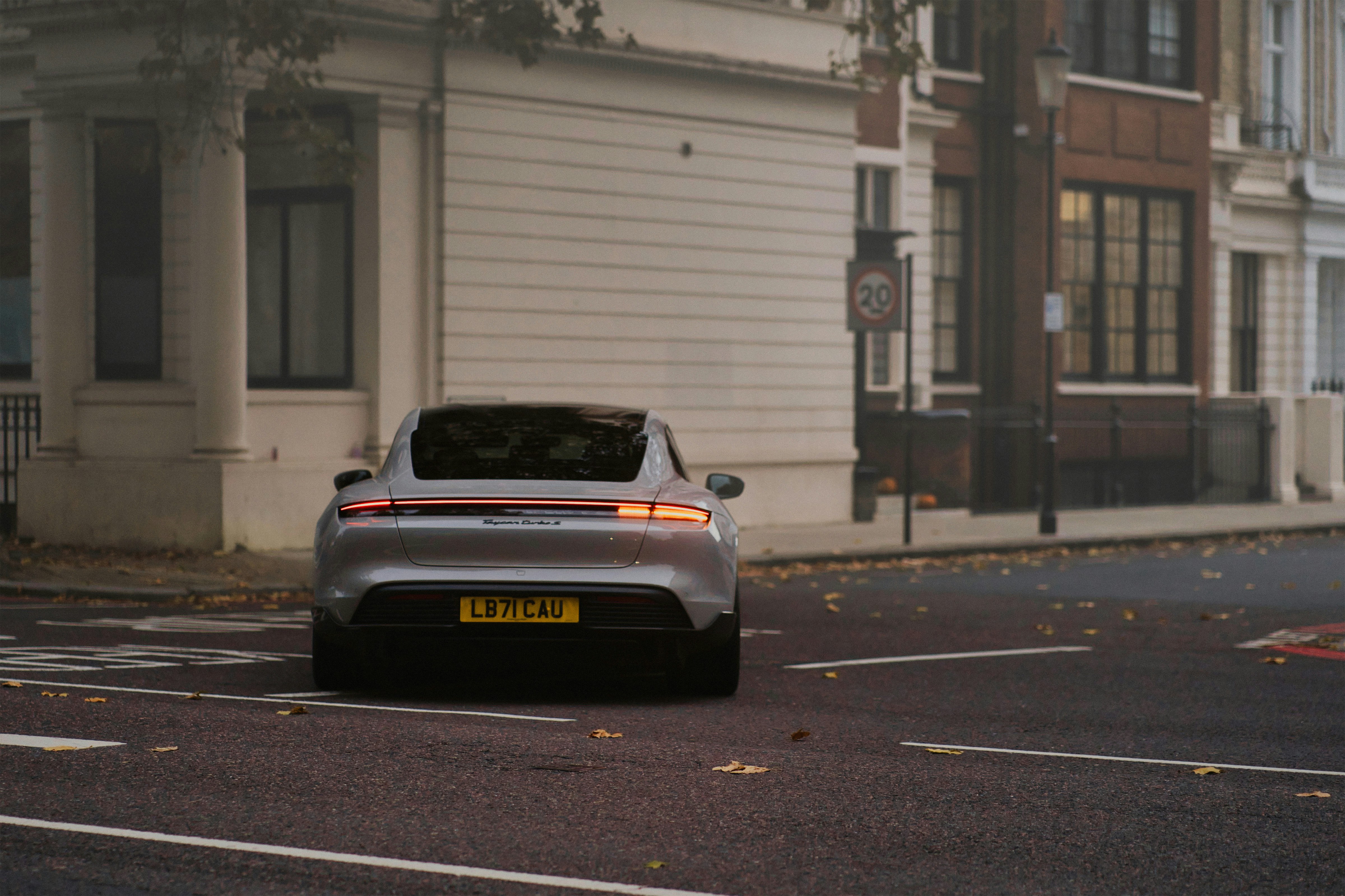 Elegance in Motion: A Silver Porsche at Dusk