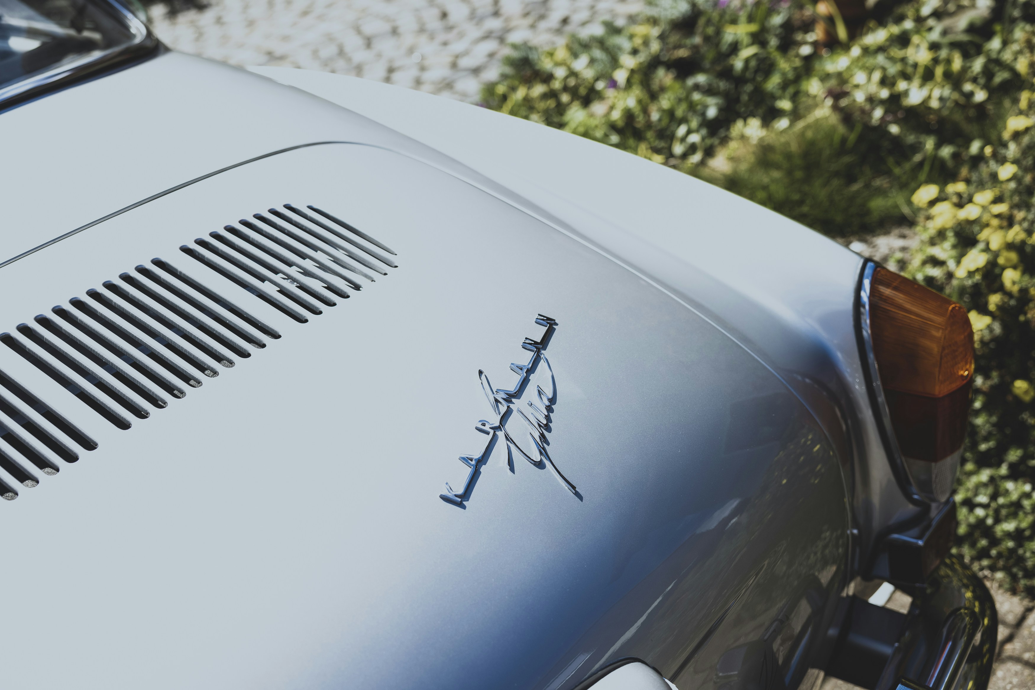 Vintage car rear crest under soft daylight