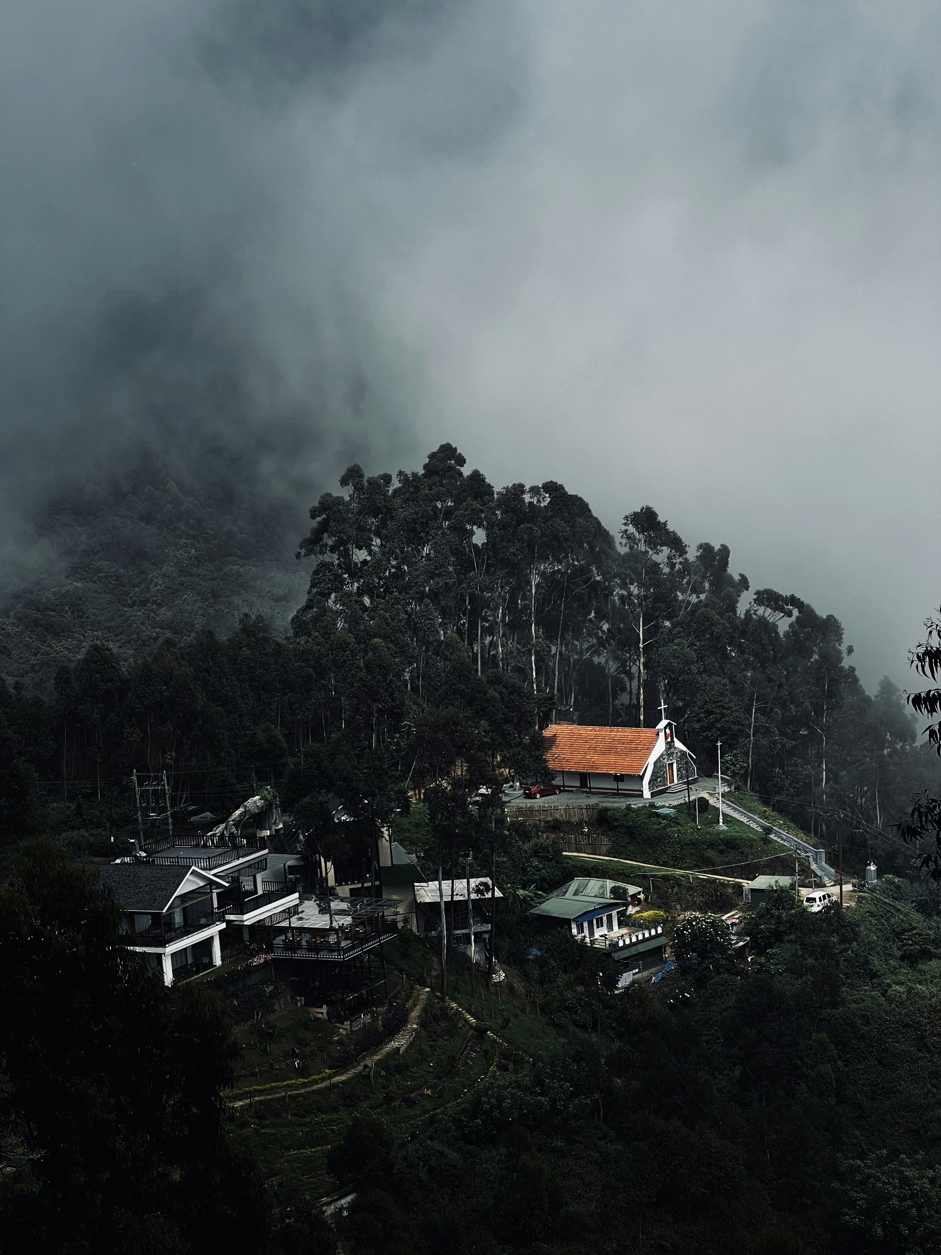 Monastic Village Cloaked in Cloud at Mountain Edge