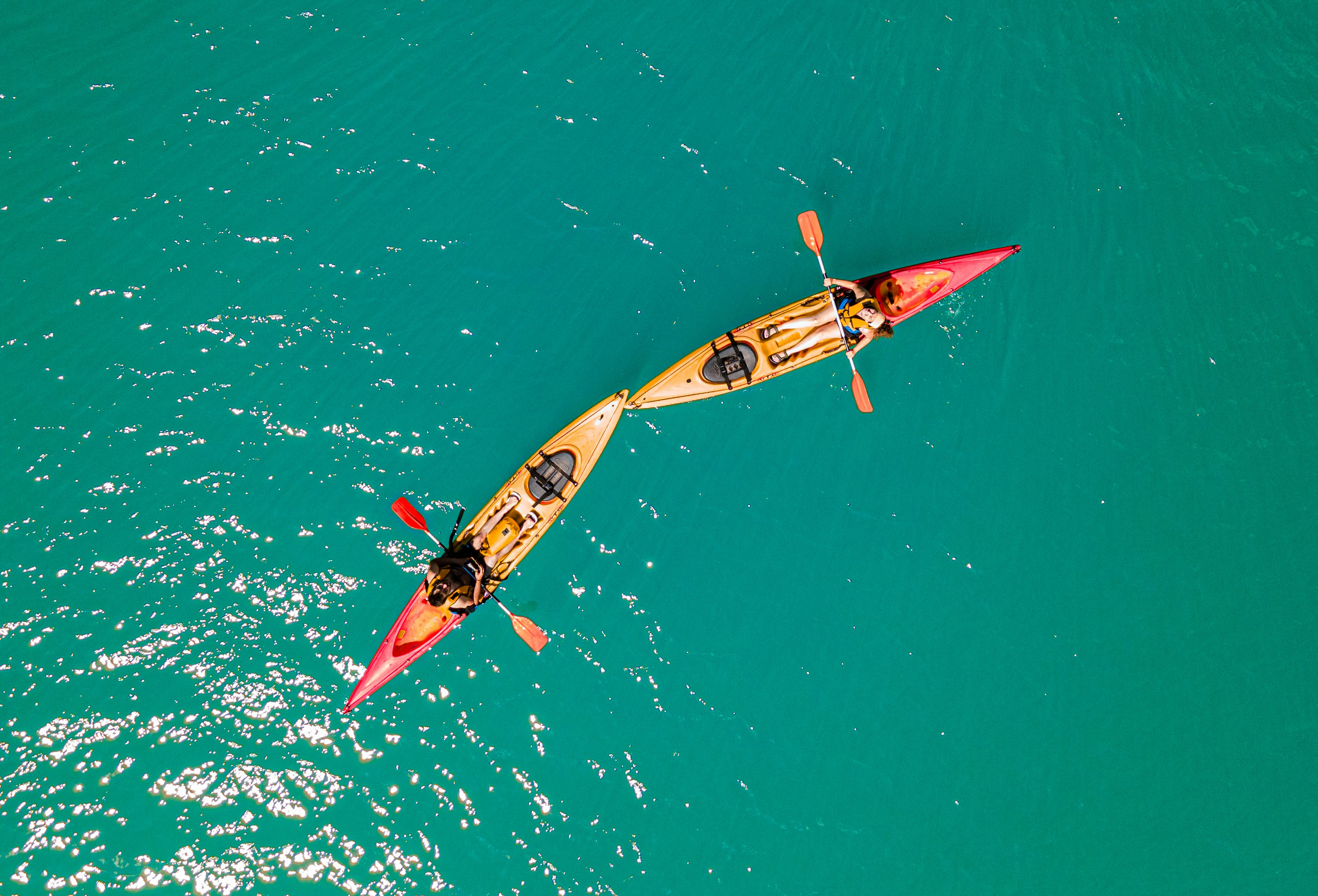 Twin Kayaks Skimming Turquoise Seas: A Drone Moment