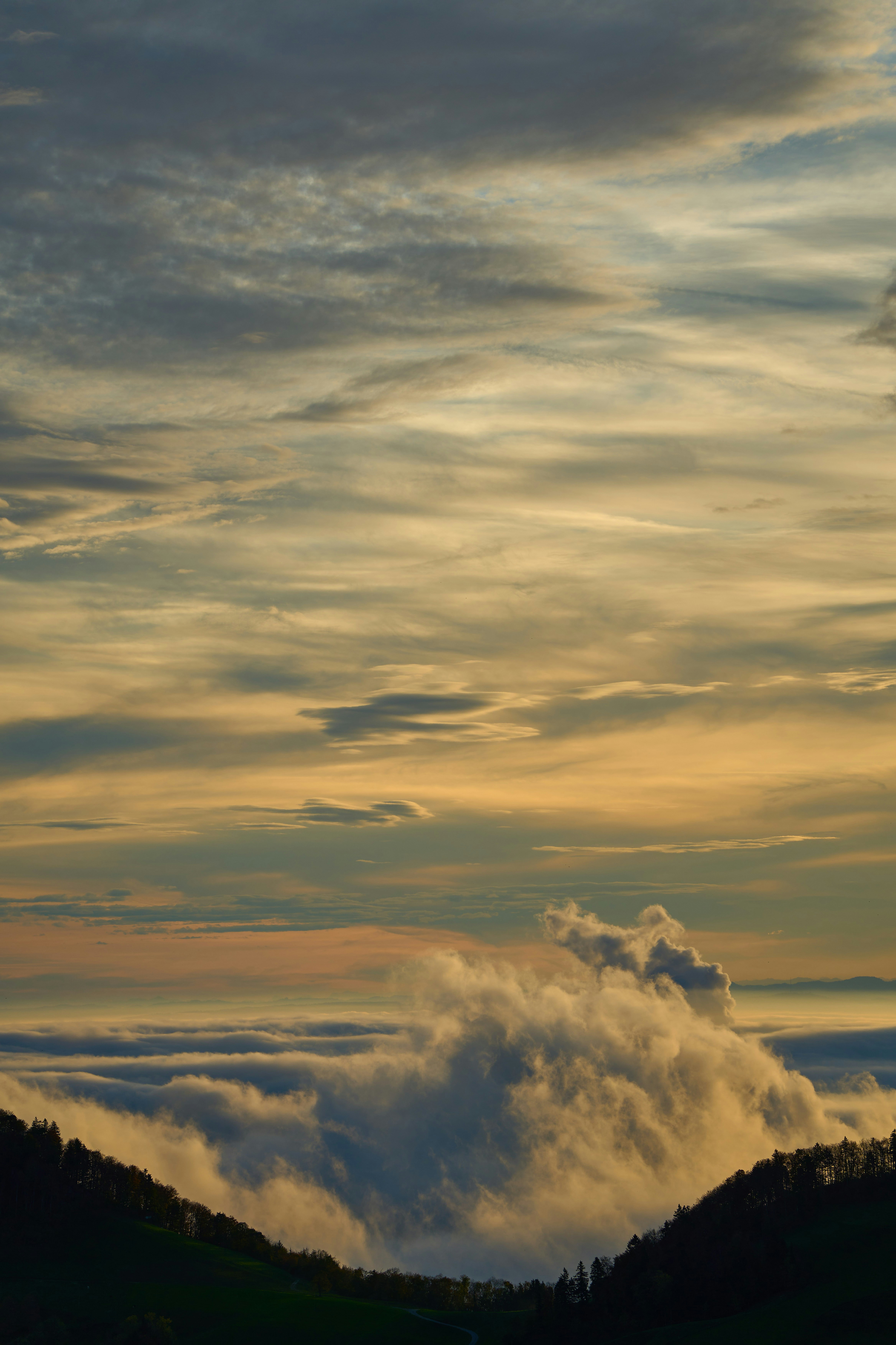 A cloudy sky over a valley photo – Free Nature Image on Unsplash