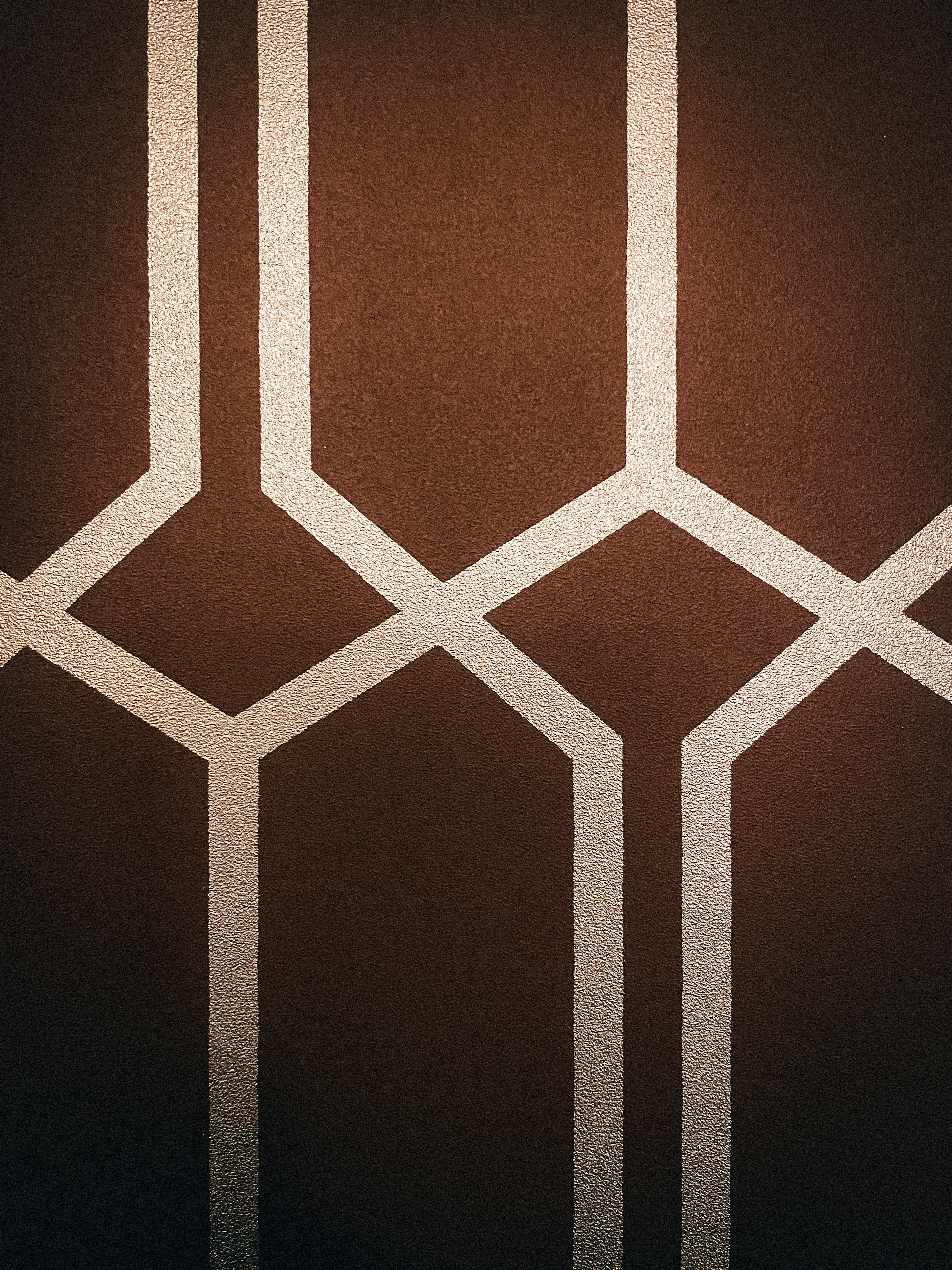 Geometric Lattice: Intersecting White Lines on Dusky Brown Canvas
