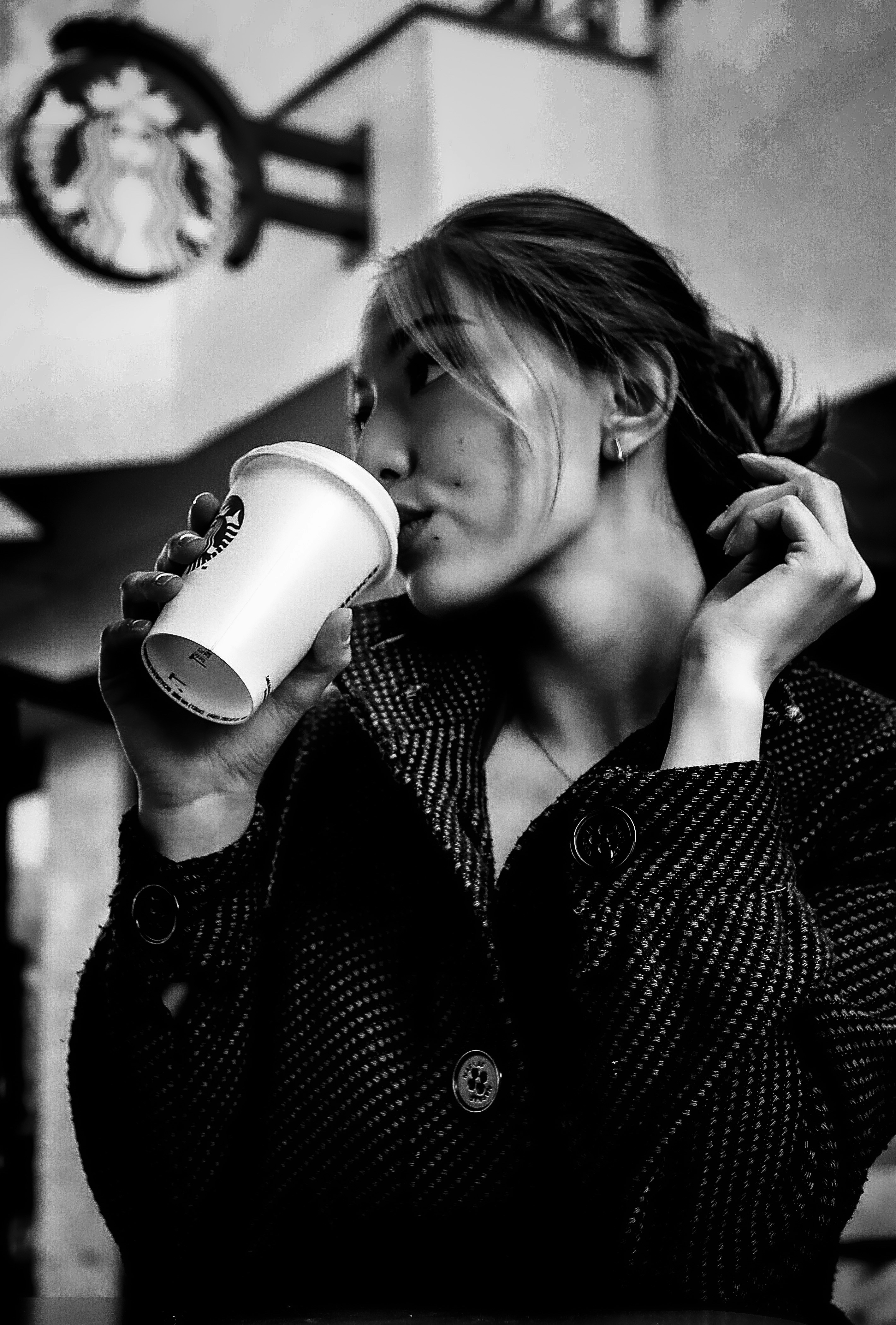Woman drinking Starbucks coffee