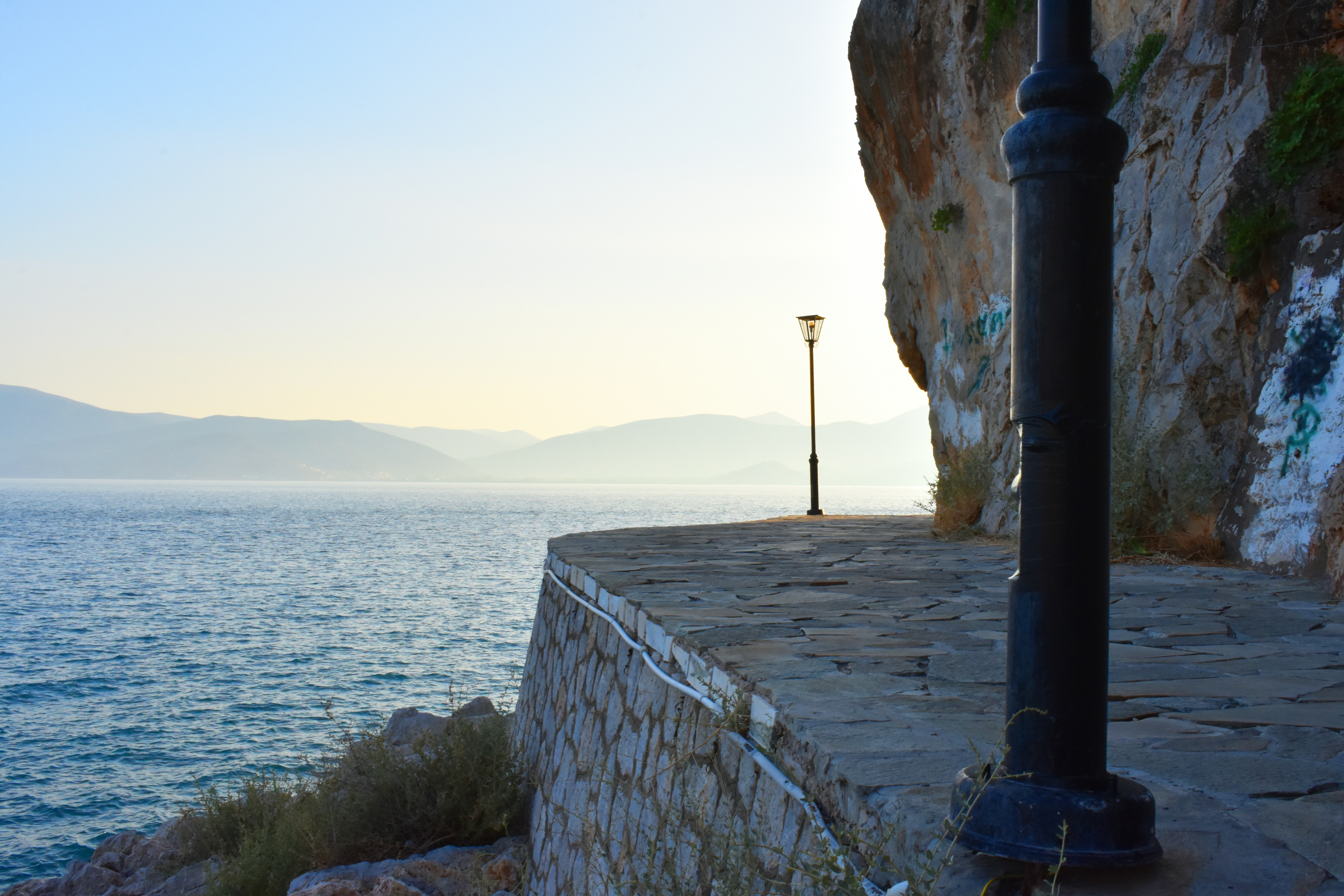 A stone walkway over water photo – Free Greece Image on Unsplash