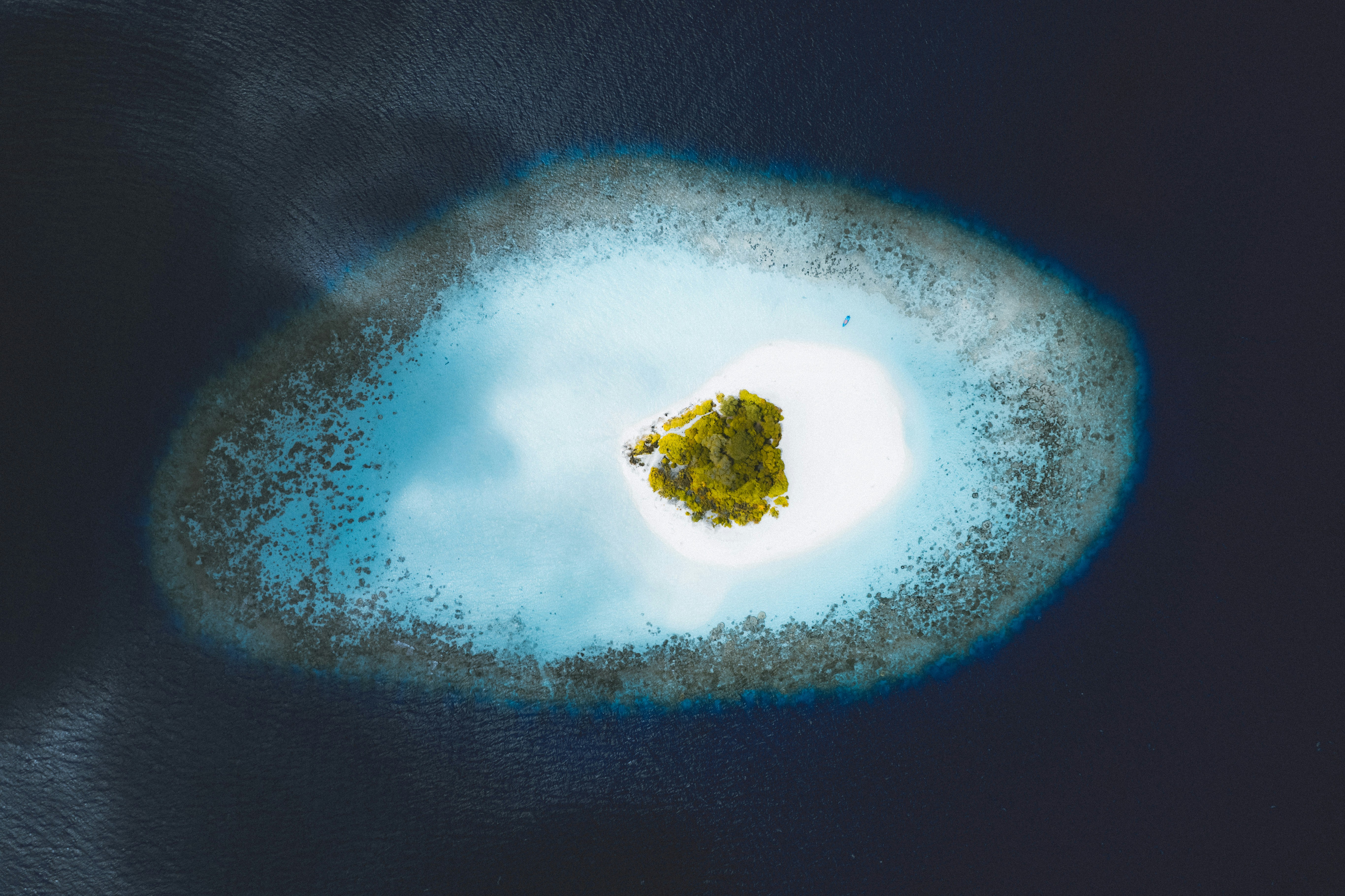 Isolated Island Ringed by Turquoise Lagoon: An Aerial Portrait