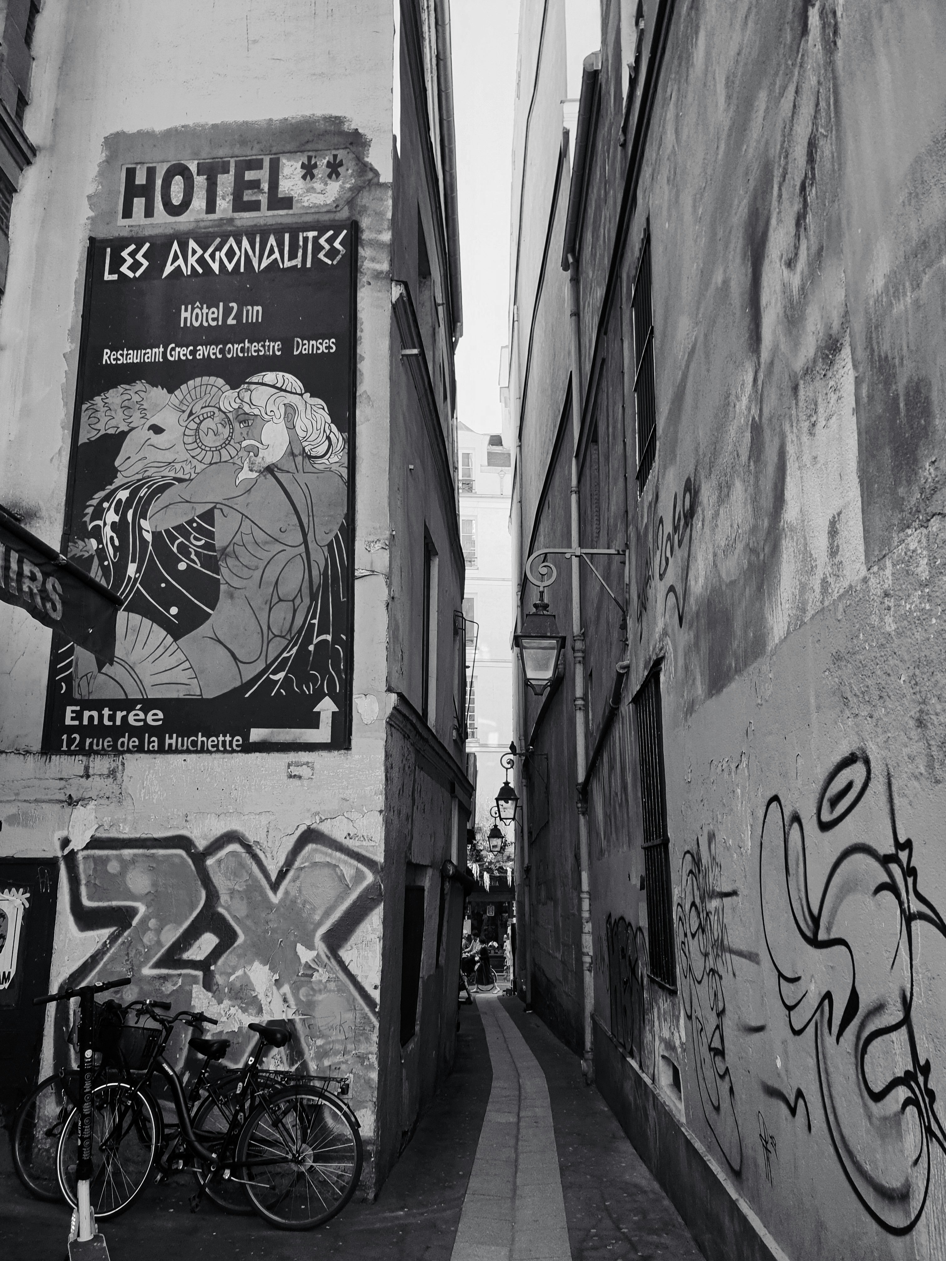 Narrow Alleyway Curtain of Graffiti and Signage