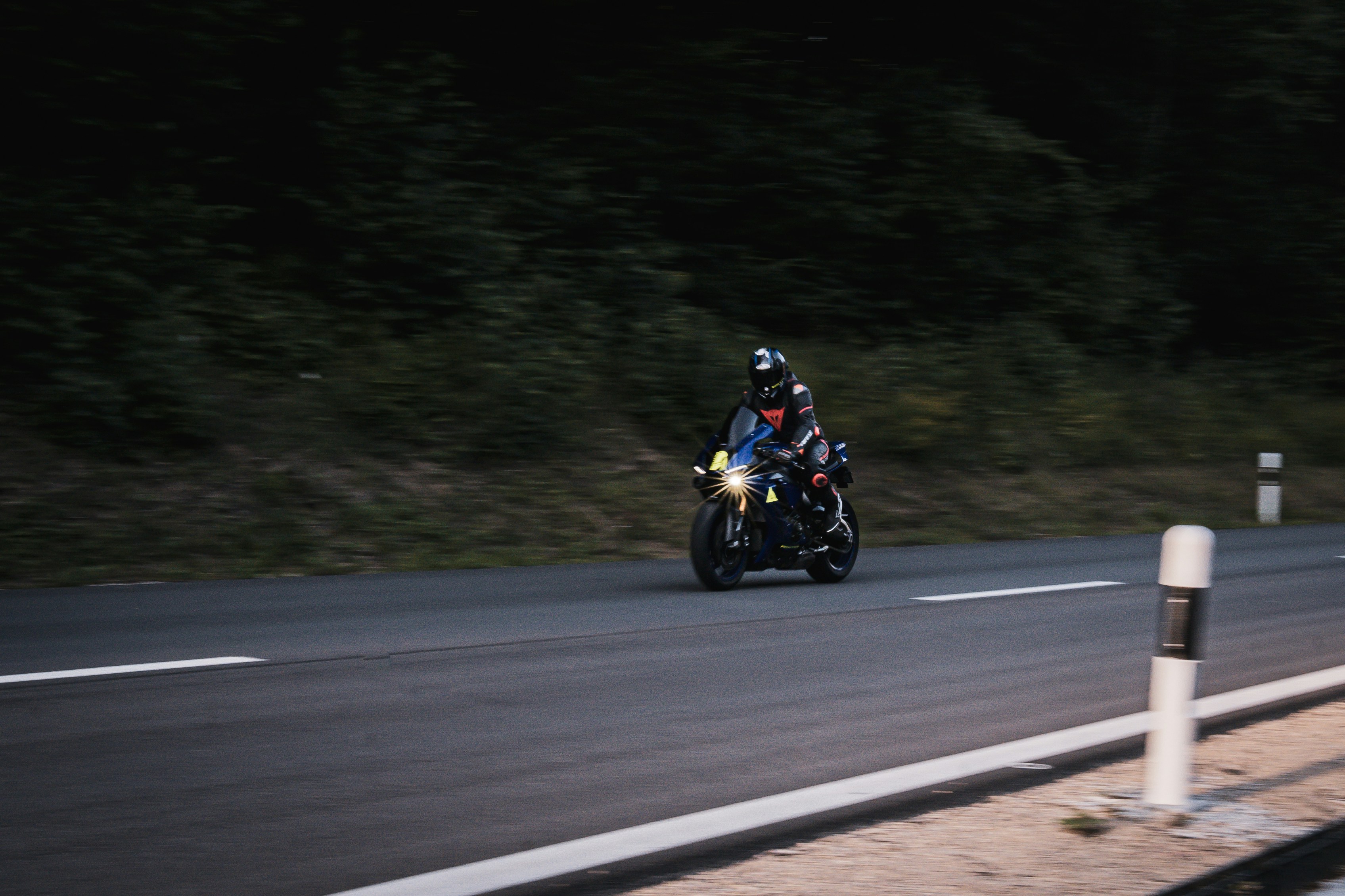 A person riding a motorcycle on a road photo – Free Aarau Image on Unsplash