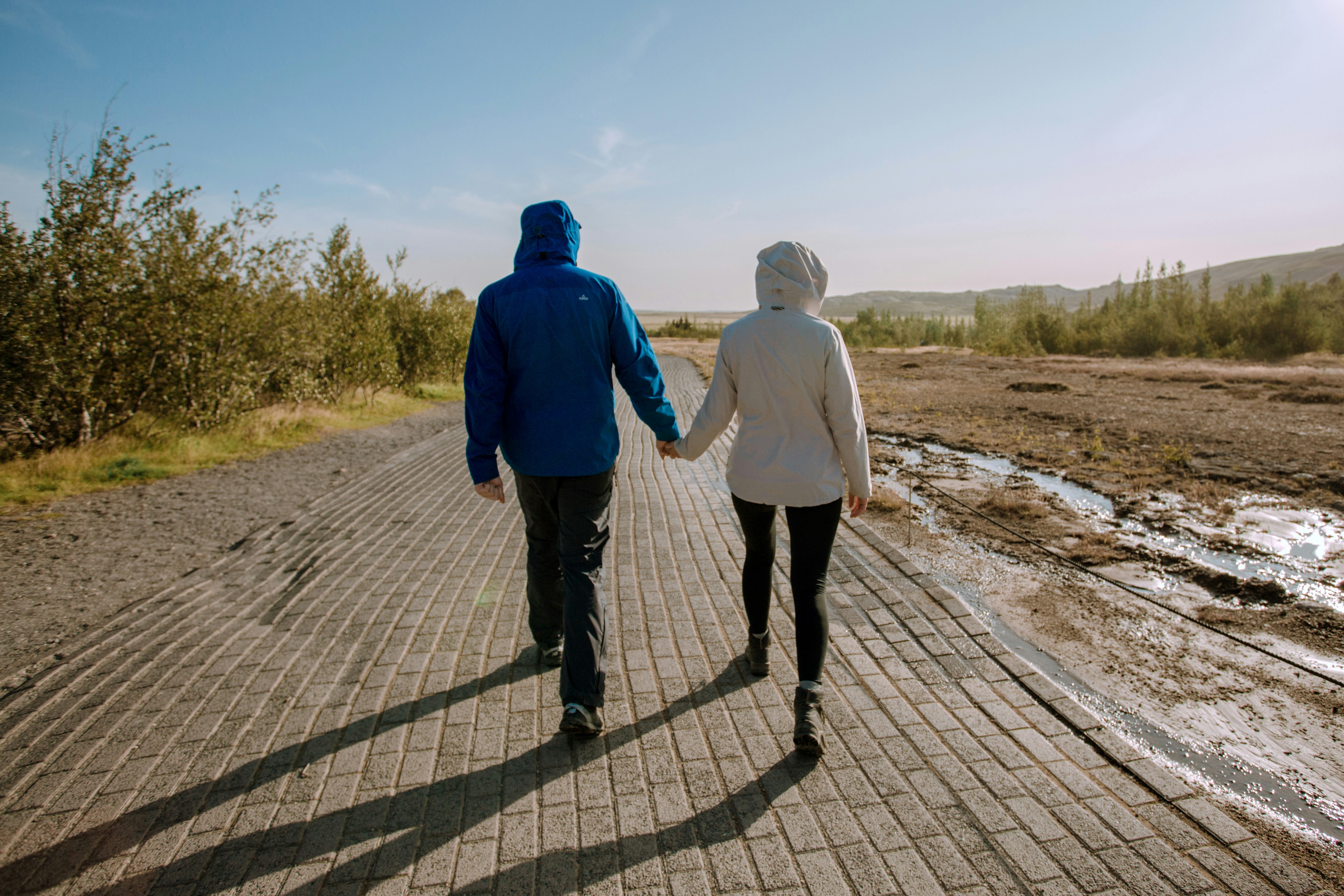 Two people walking on a wooden path photo – Free Iceland Image on Unsplash