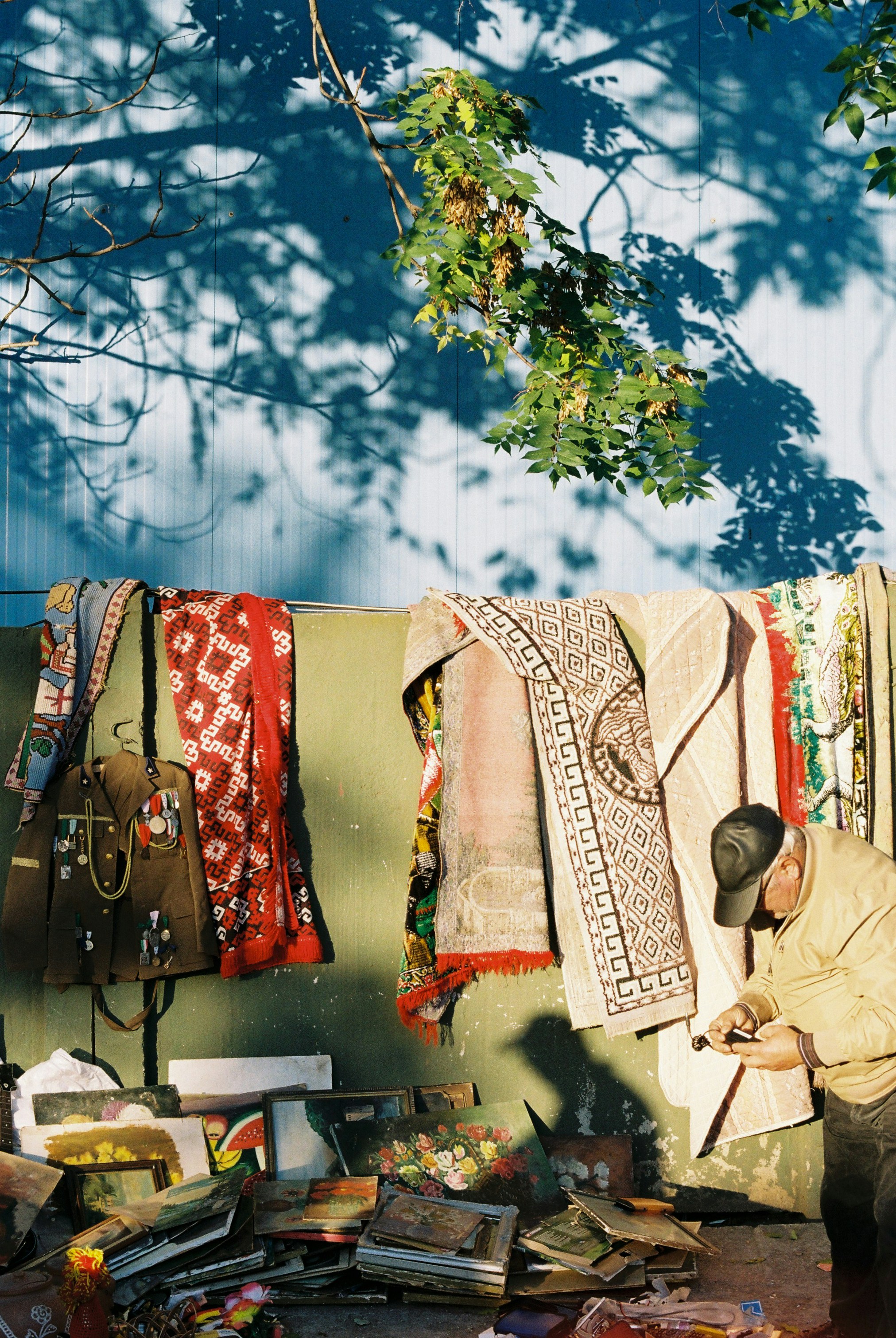 Sunlit Market Corner: Textiles and Trinkets