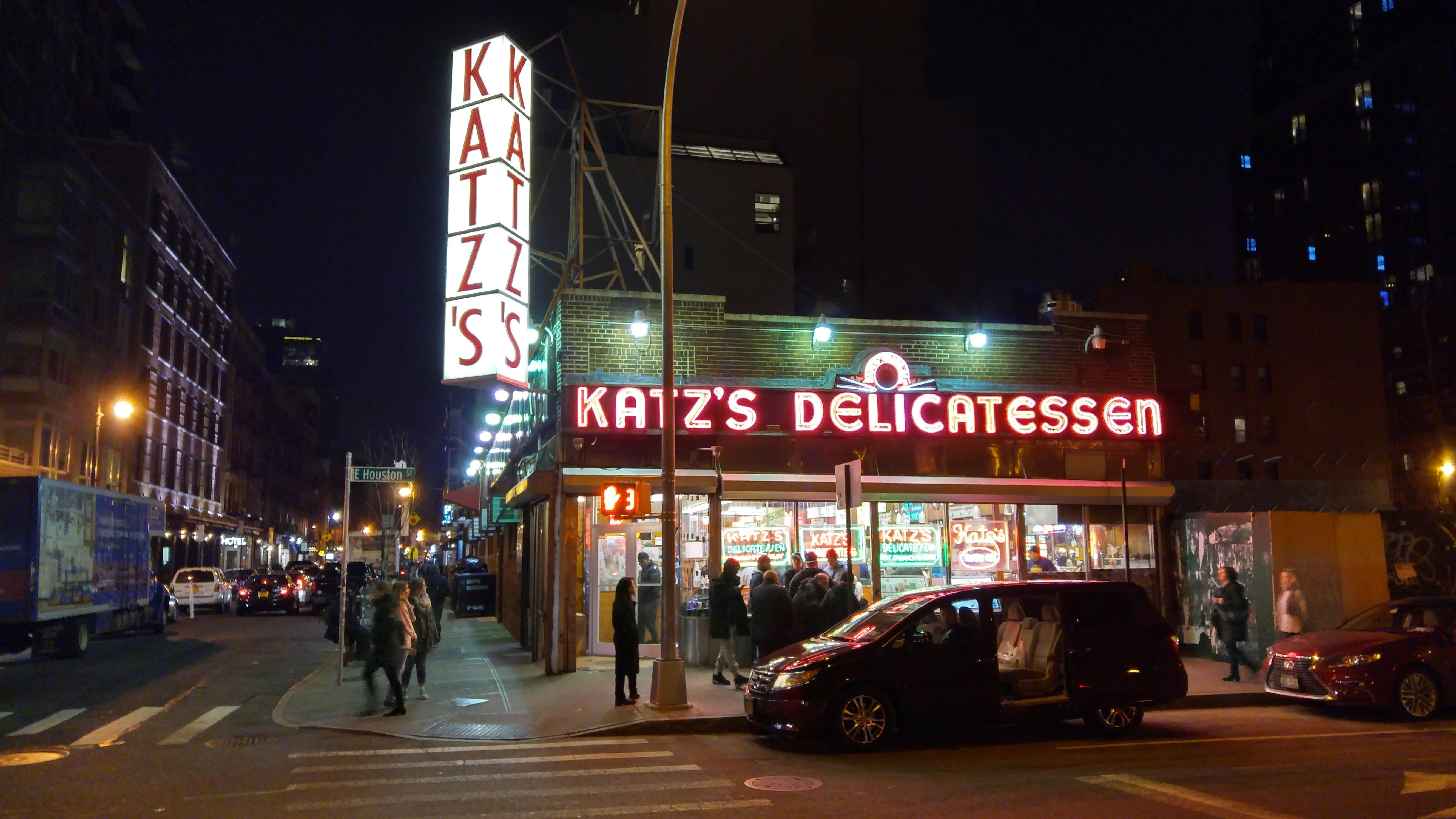 A street with a storefront and people walking on it photo – Free New ...