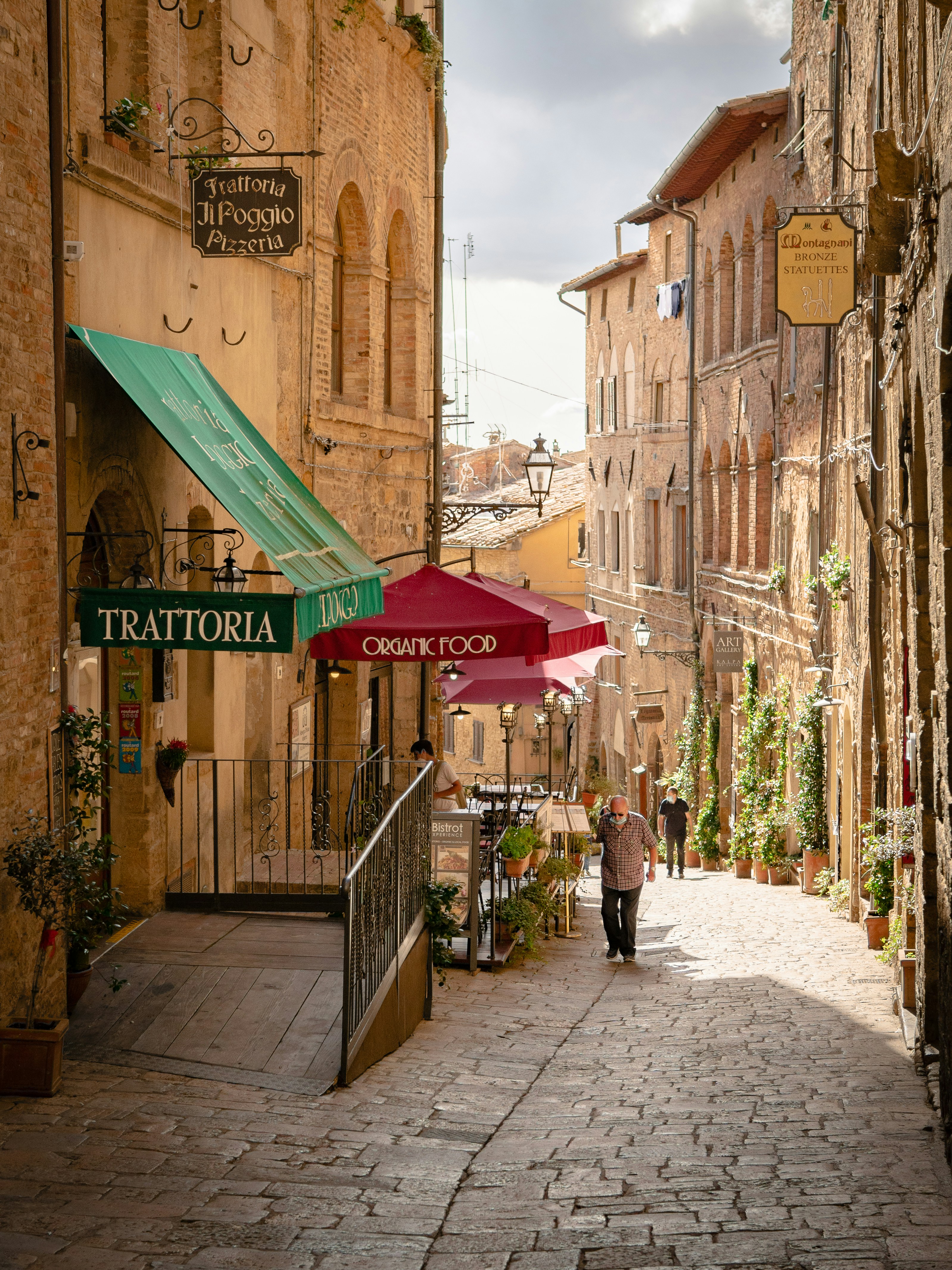 Sunlit Trattoria Lane: Stone Facades, Green Awnings, and a Gentle Pedestrian
