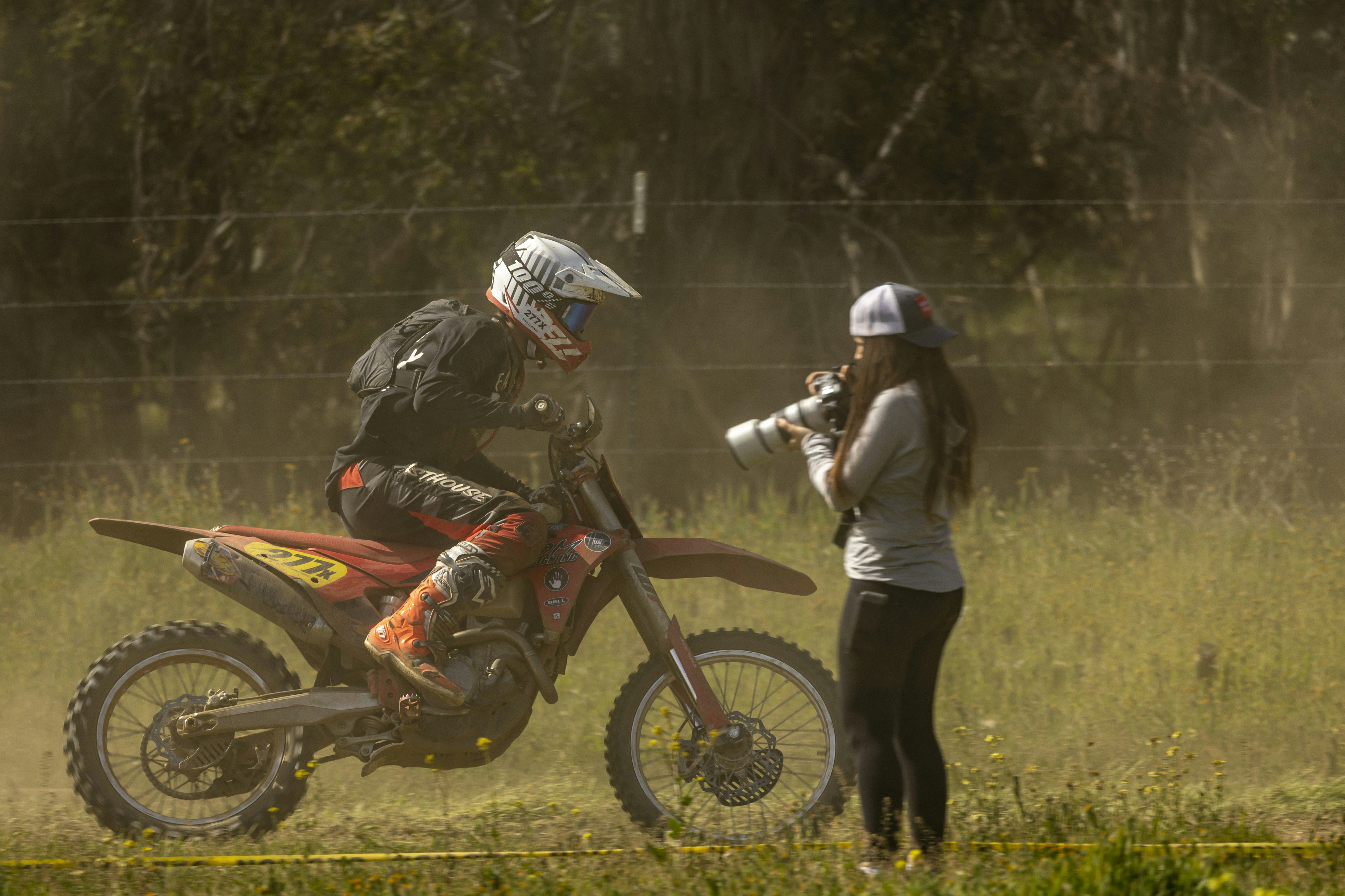 A man on a motorcycle spraying water on a woman photo – Free Dirt bike ...