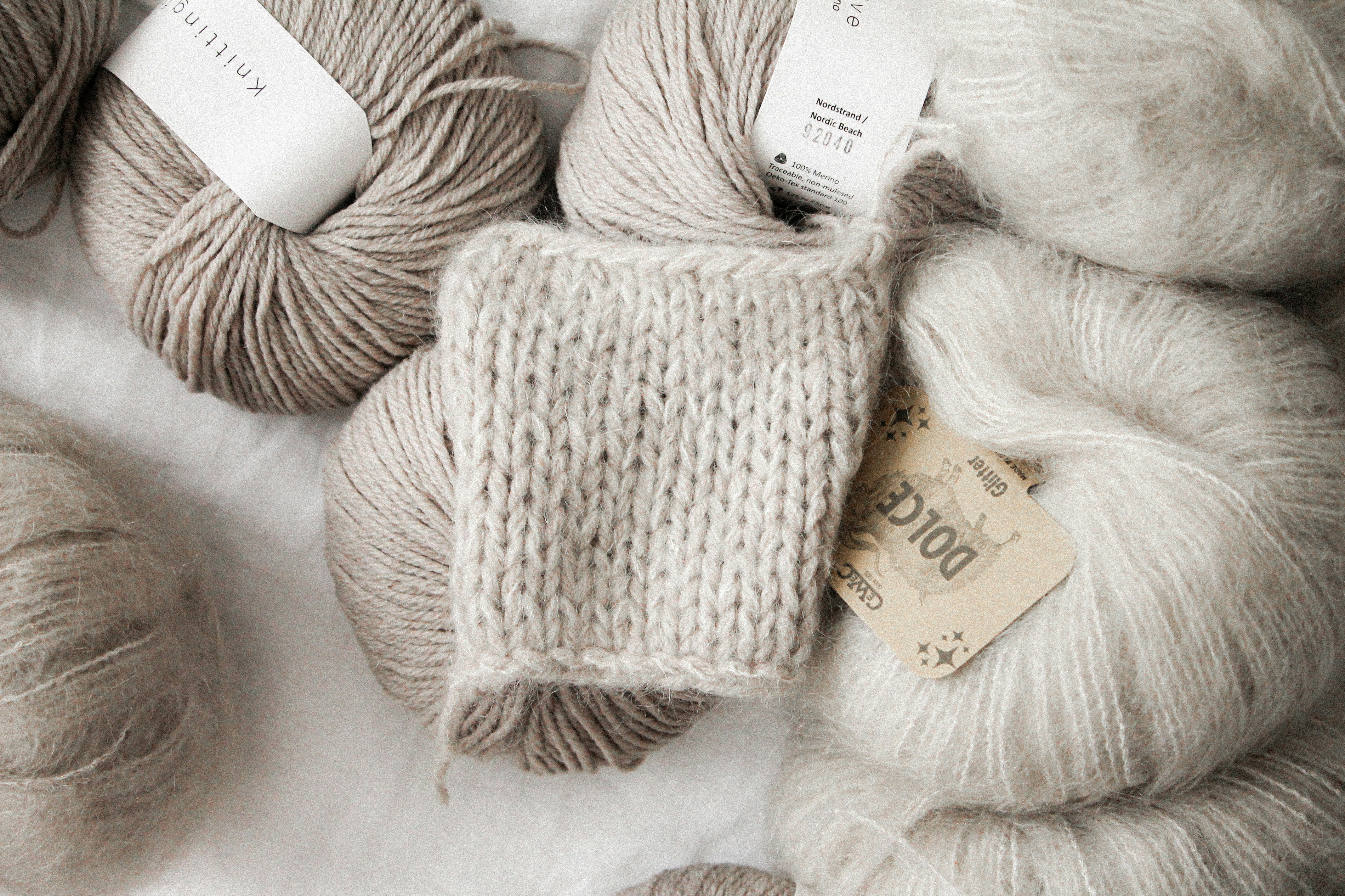 Cream Knit Among Soft Skeins: A Quiet Macro Still Life