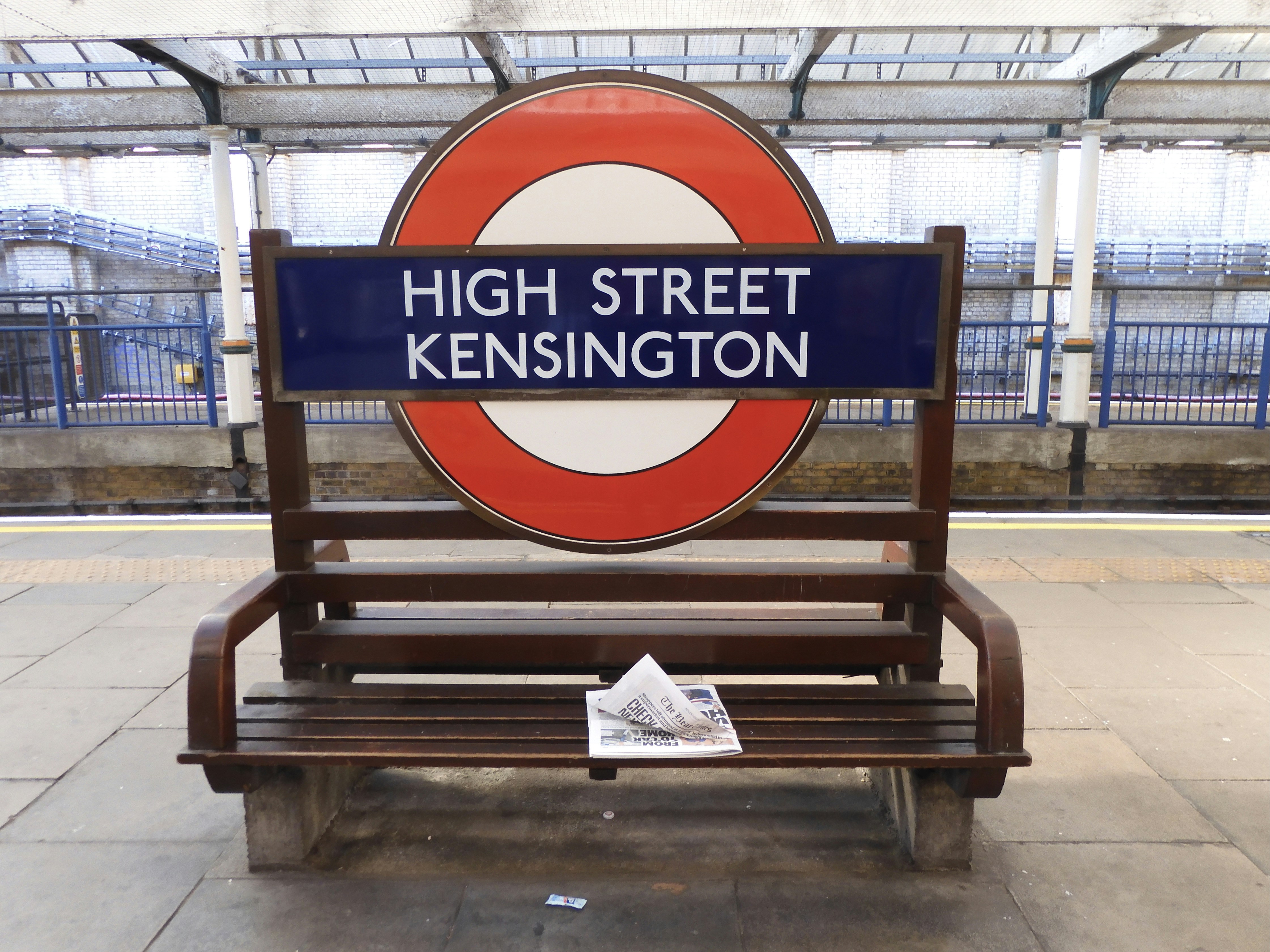 a bench with a sign on it