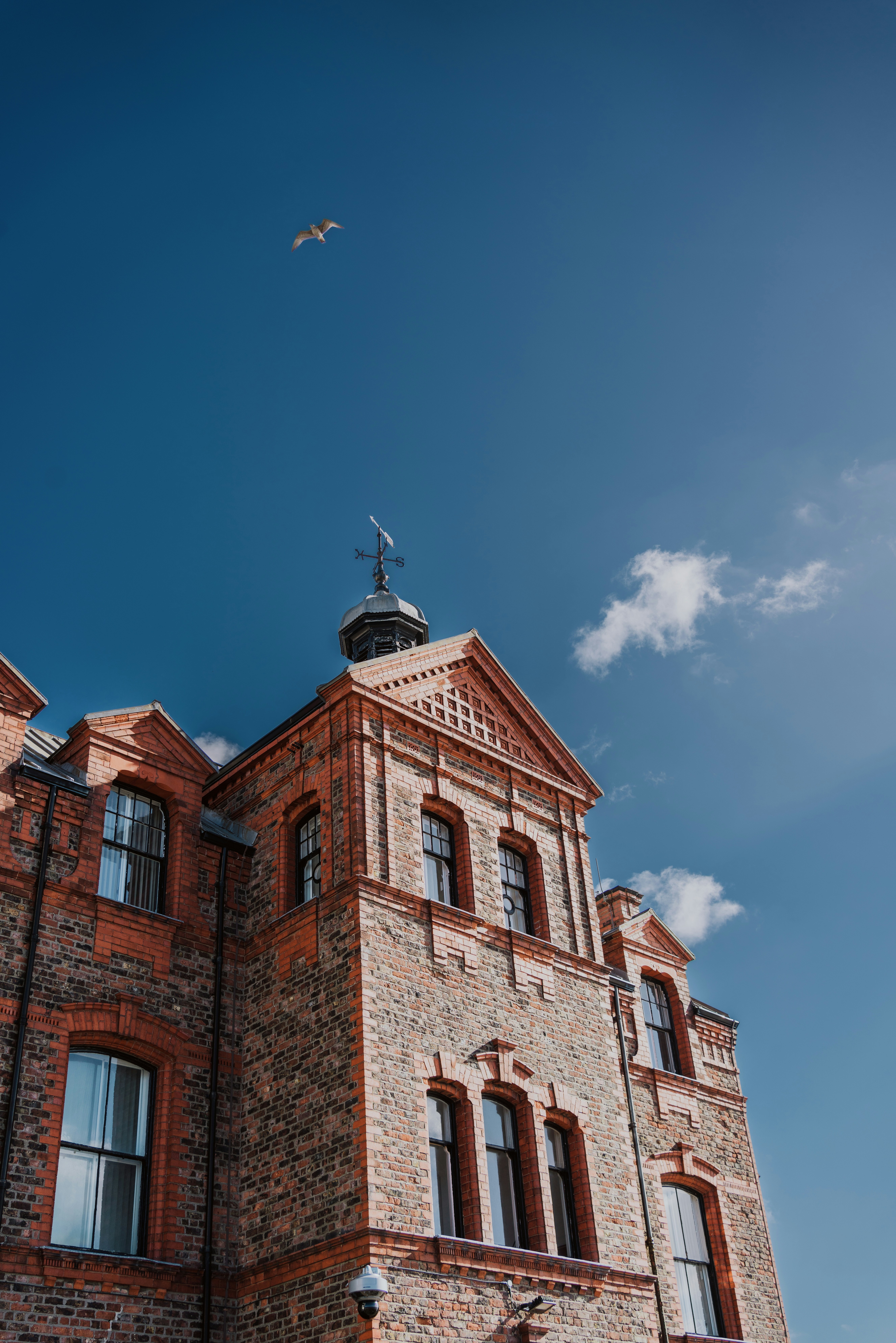 Brick Gothic: The Corner Tower Reaches Toward a Clear Sky