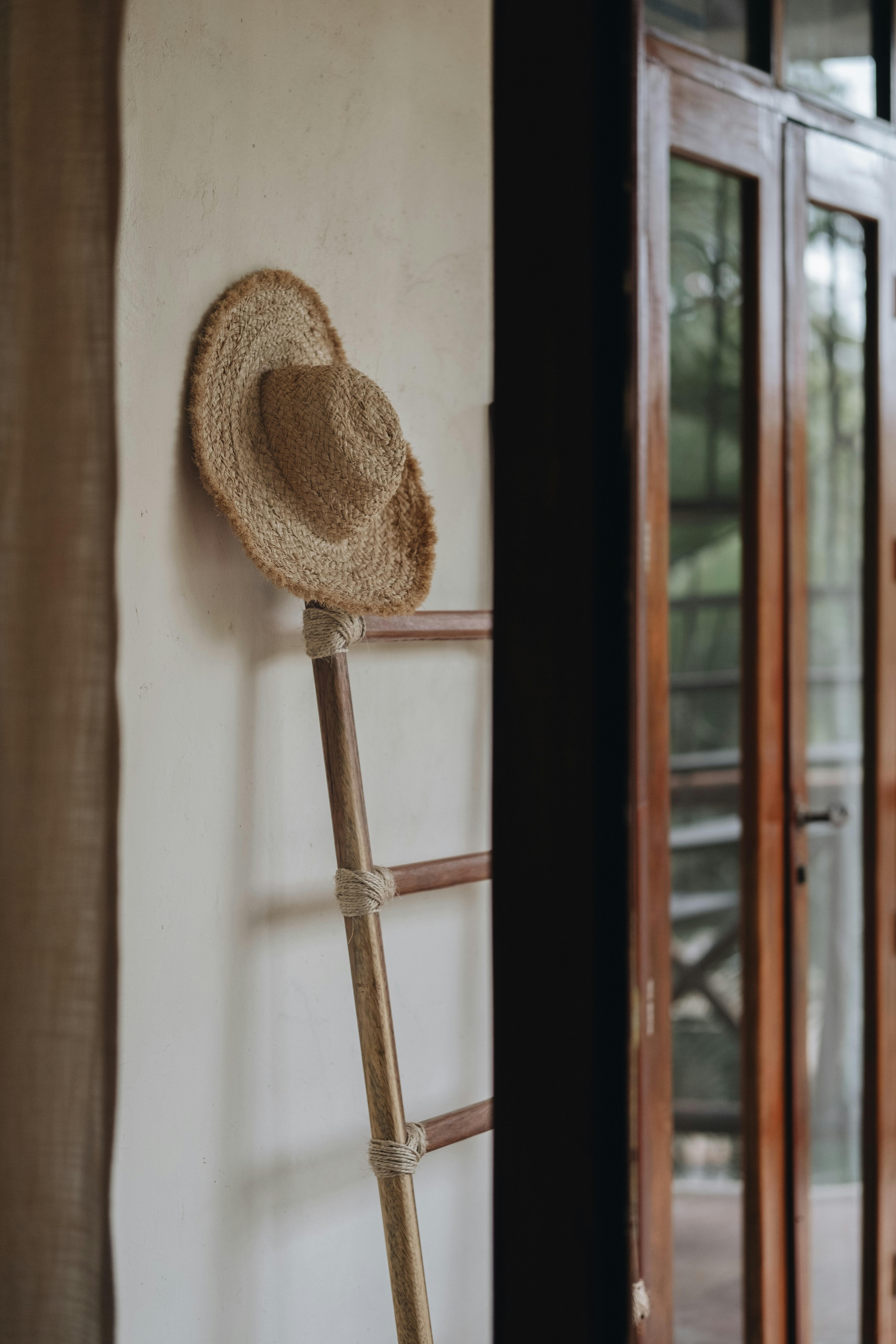 Straw Hat Resting on a Wooden Staircase