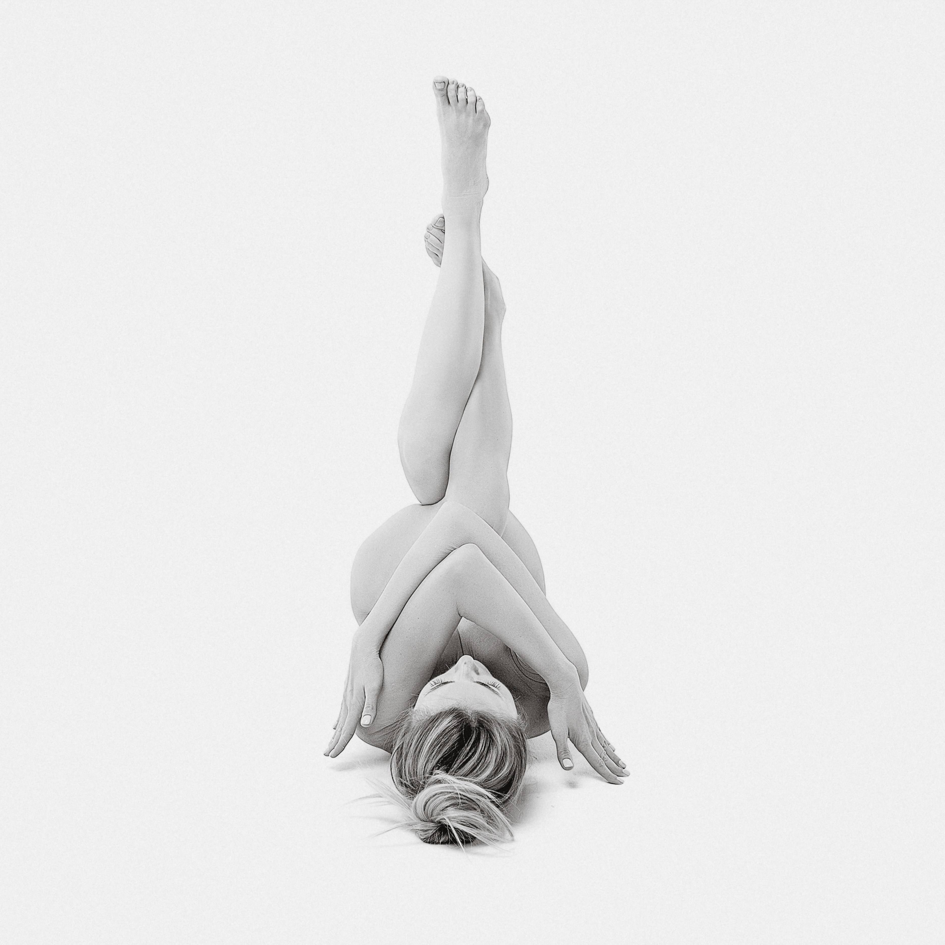 Inverted Quiet: A Nude Figure in Minimal White Space