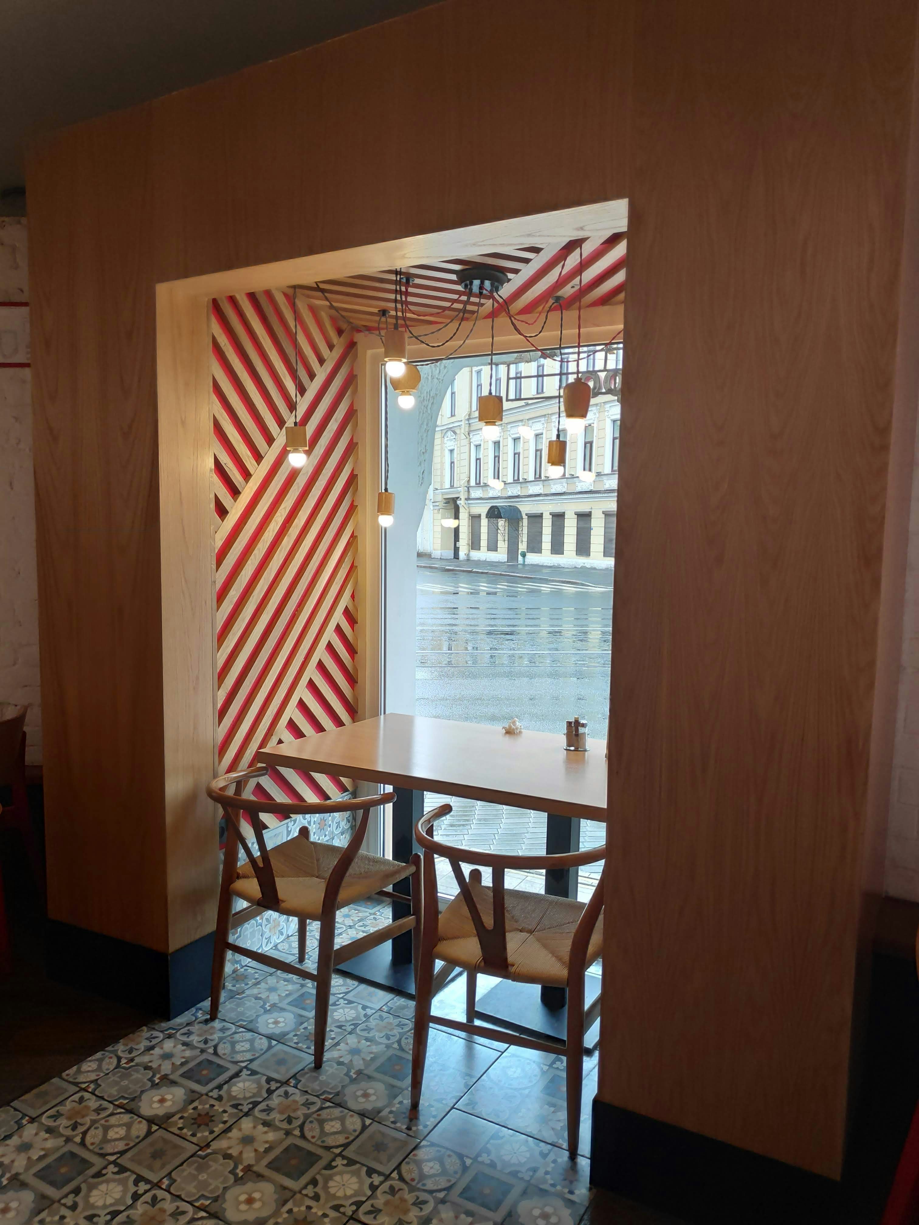 Hidden Window Bistro: A Corner Table by the Striped Wall