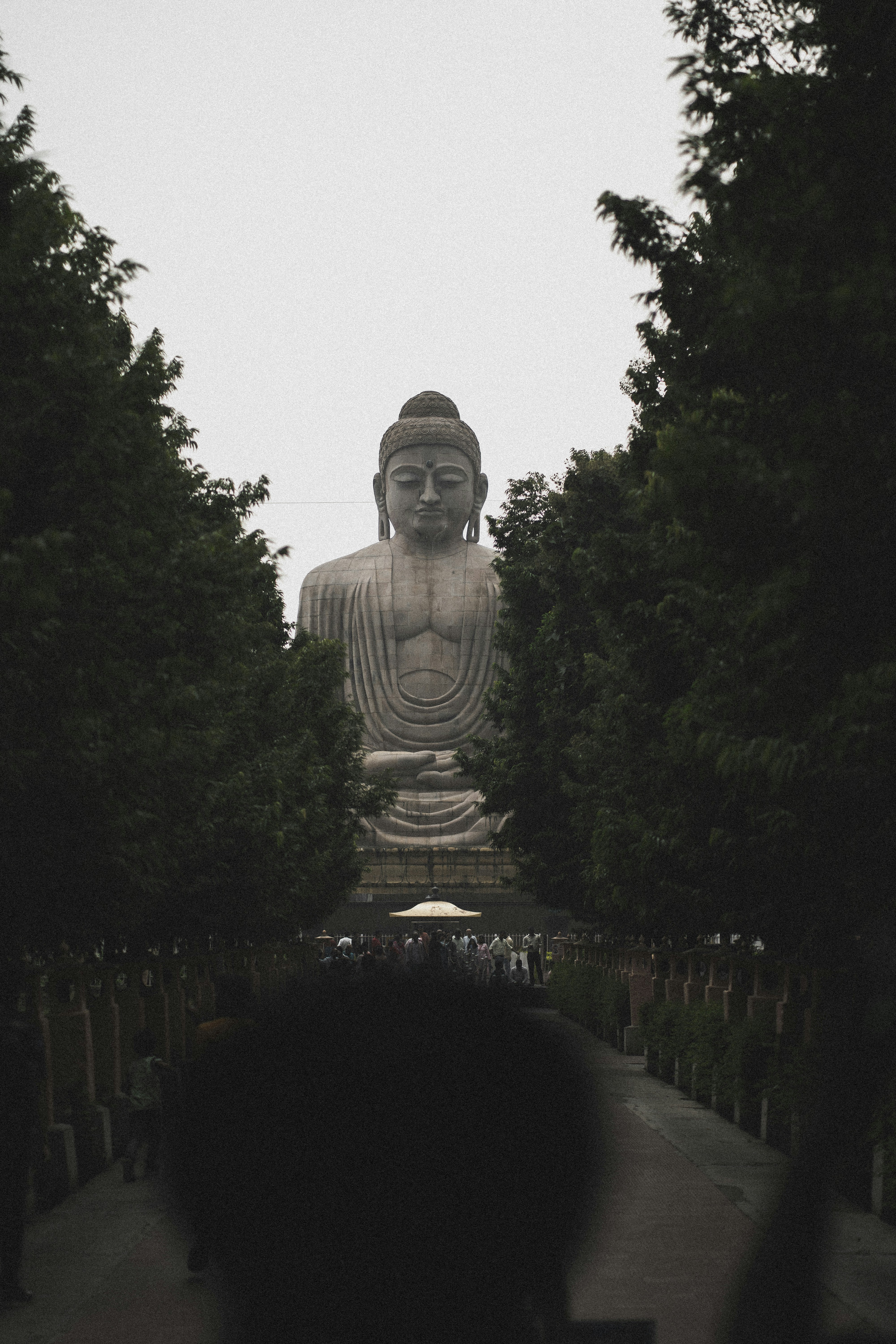 A large statue of a person with a crown and a long neck photo – Free ...