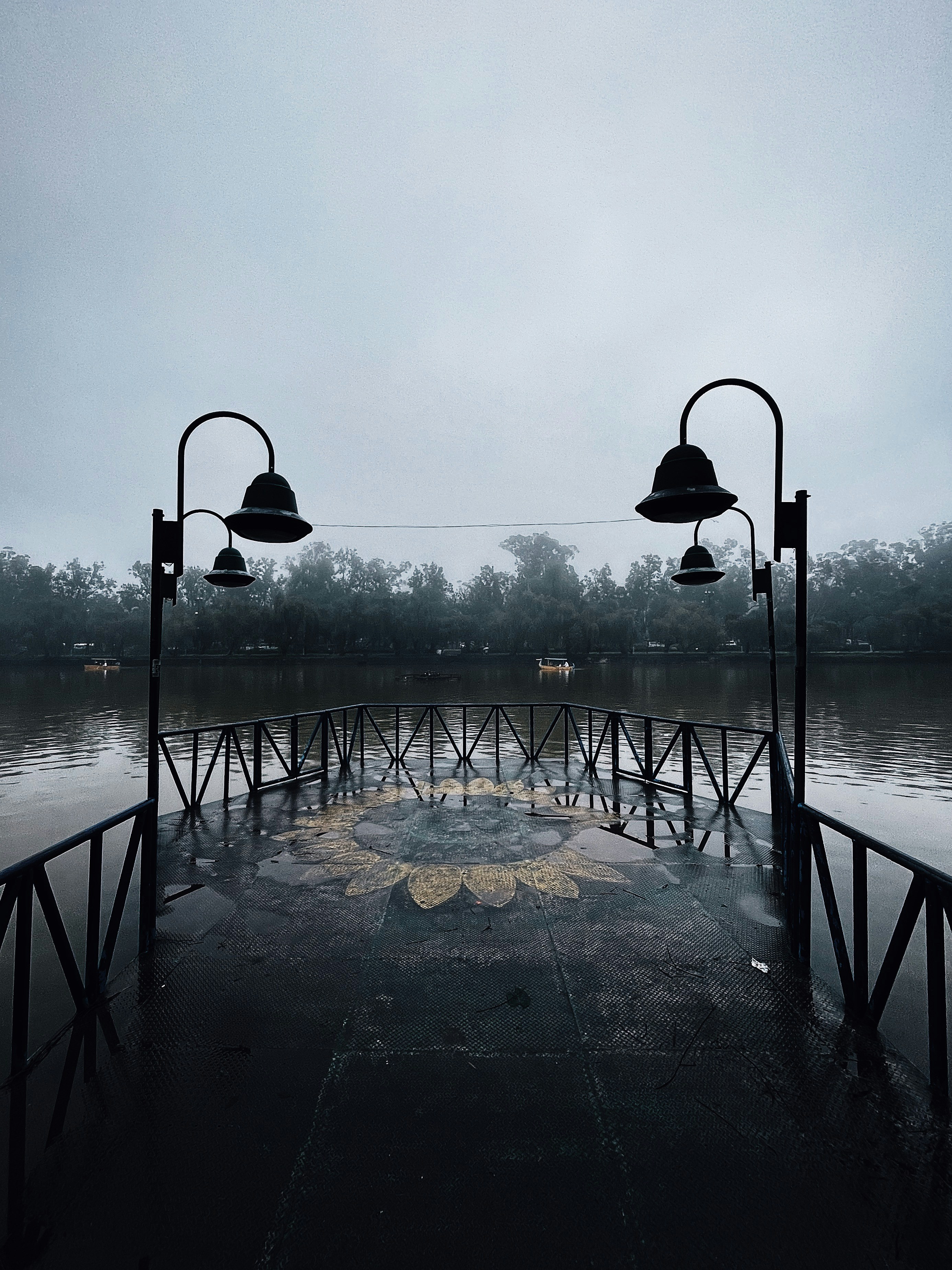 a row of street lights on a pier