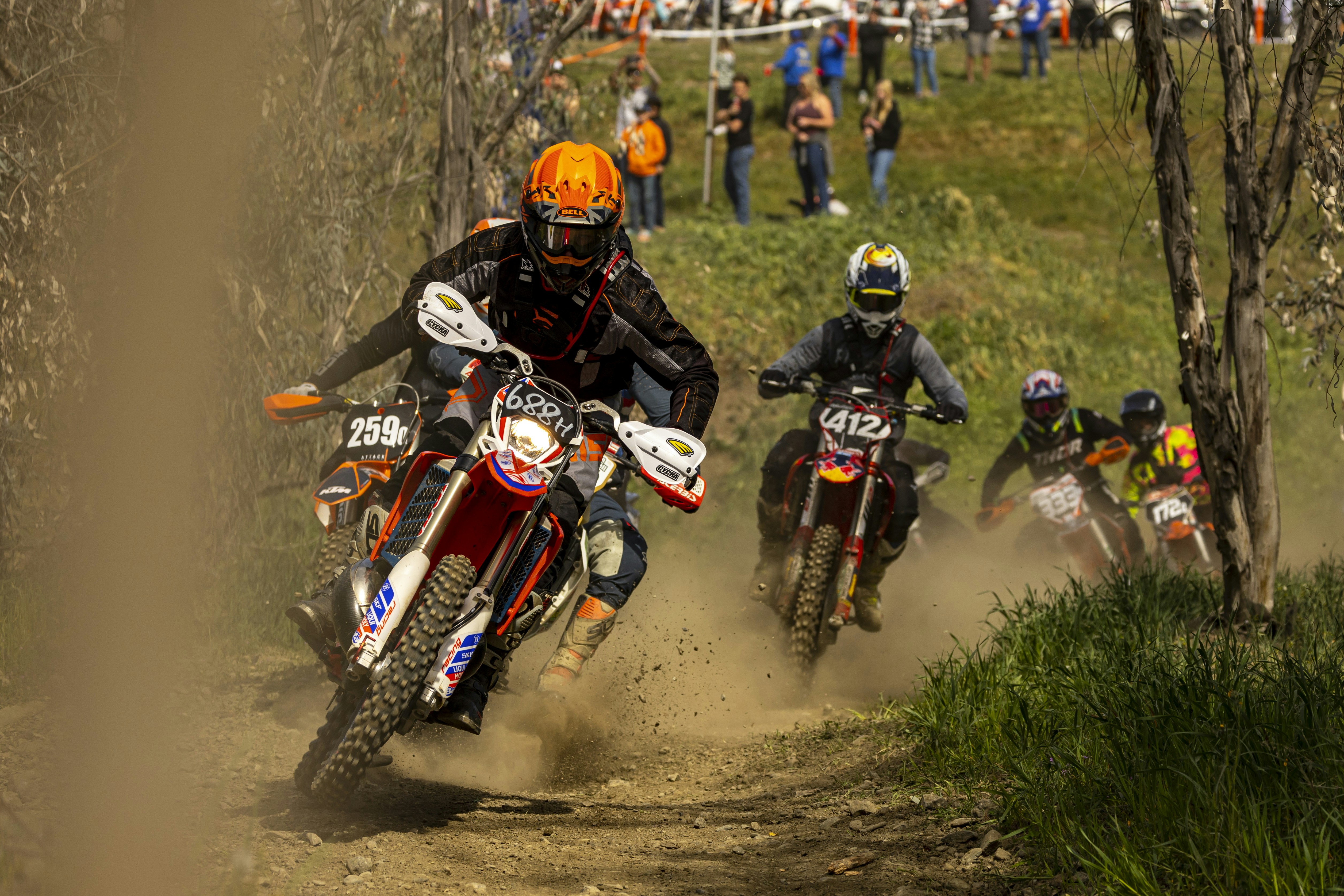 A group of people riding dirt bikes photo – Free Vehicle Image on Unsplash