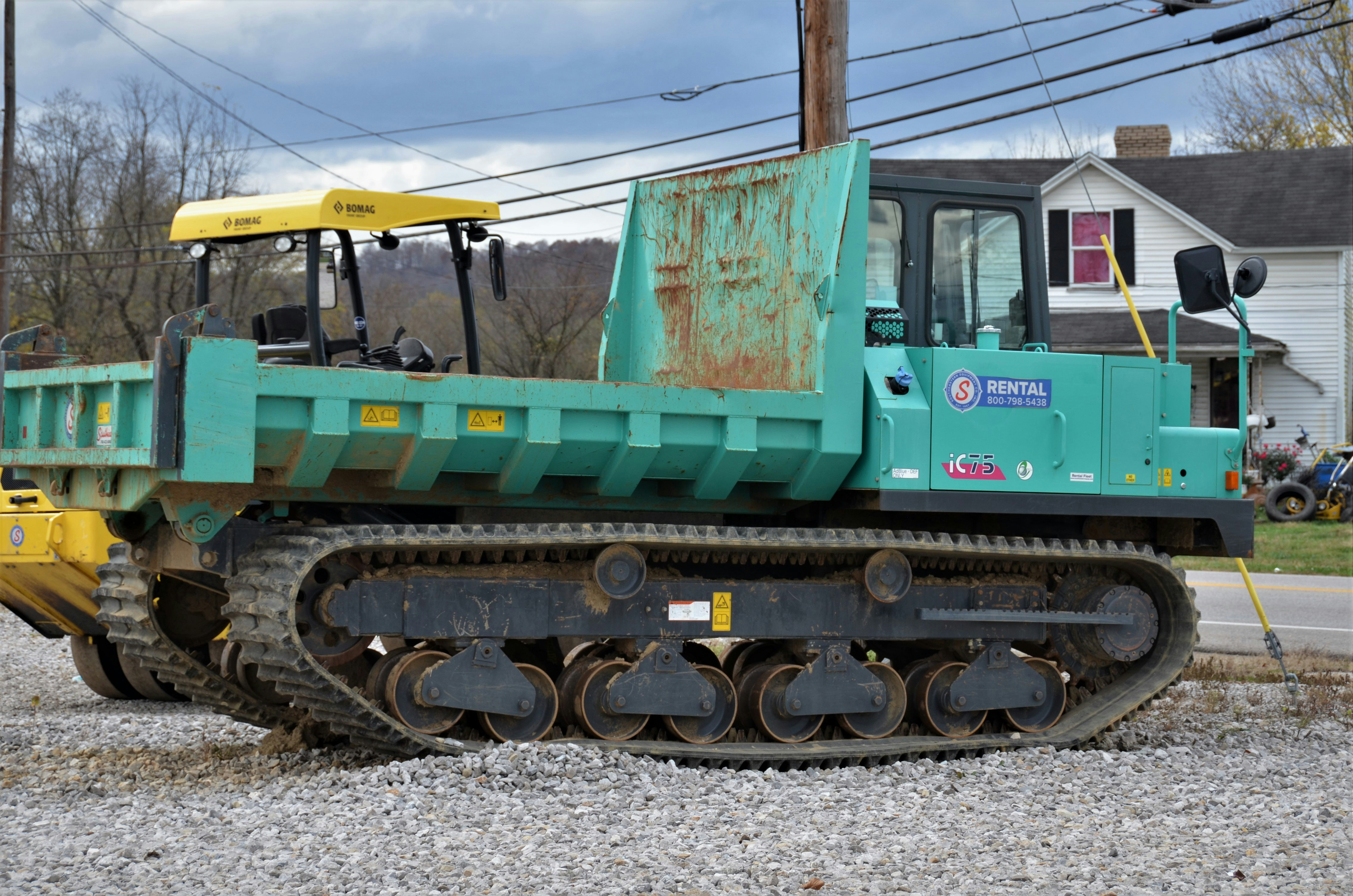 Rugged Crawler on Gravel: A Heavy Duty Workhorse by the Railroad