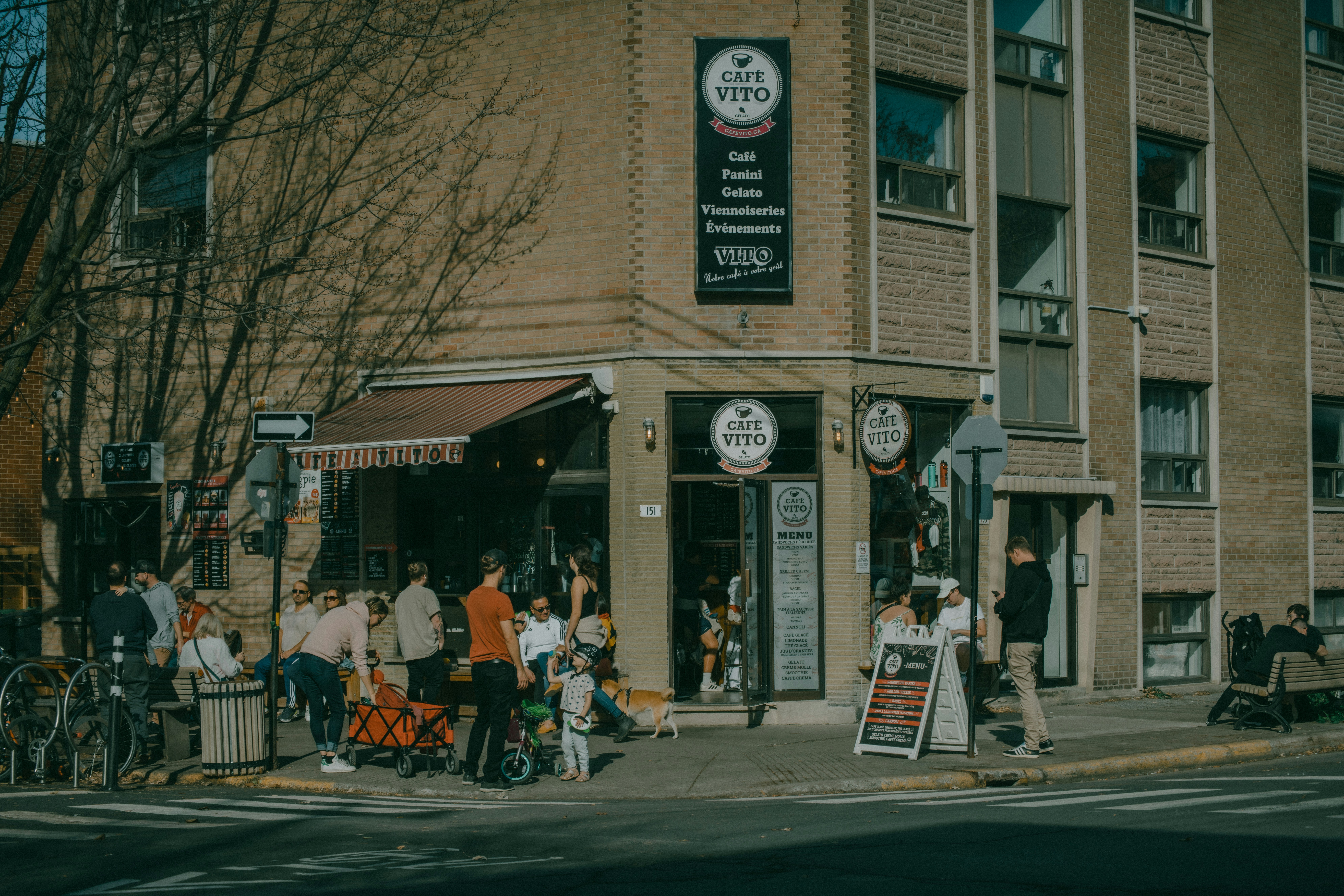 A group of people stand outside a building photo – Free Montreal Image ...