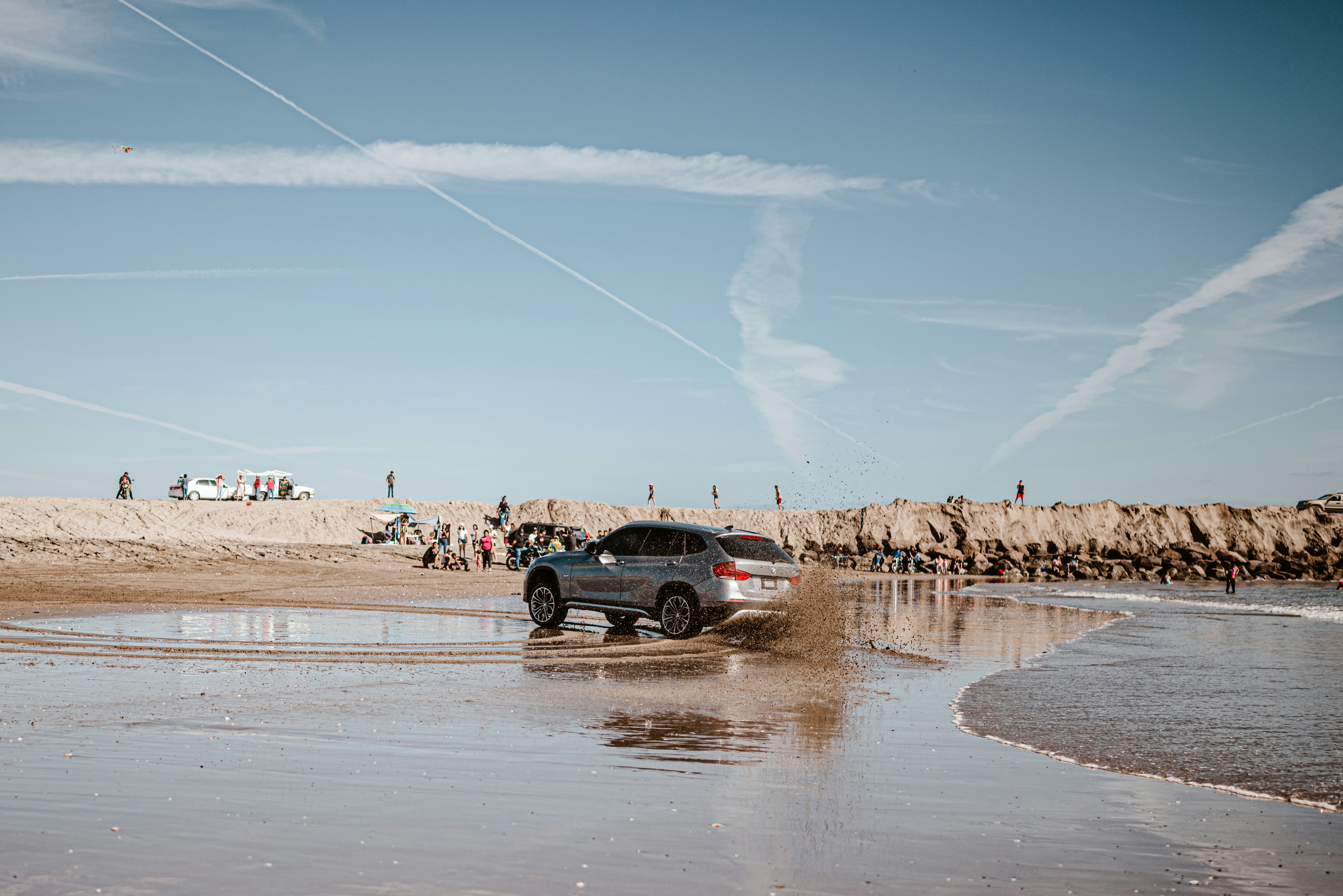 A car on a beach photo – Free Drifting Image on Unsplash
