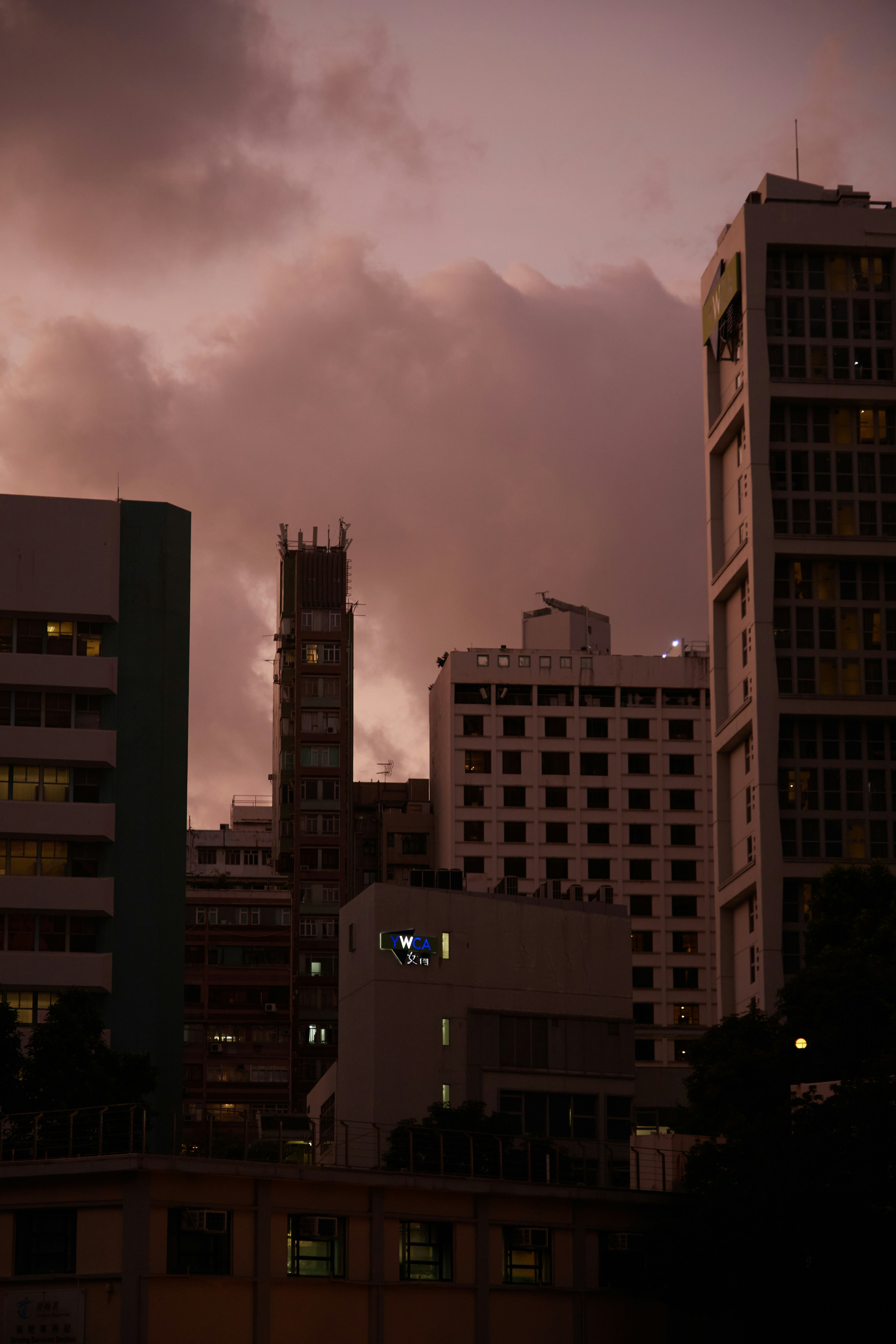 A group of buildings with a cloudy sky photo – Free City Image on Unsplash