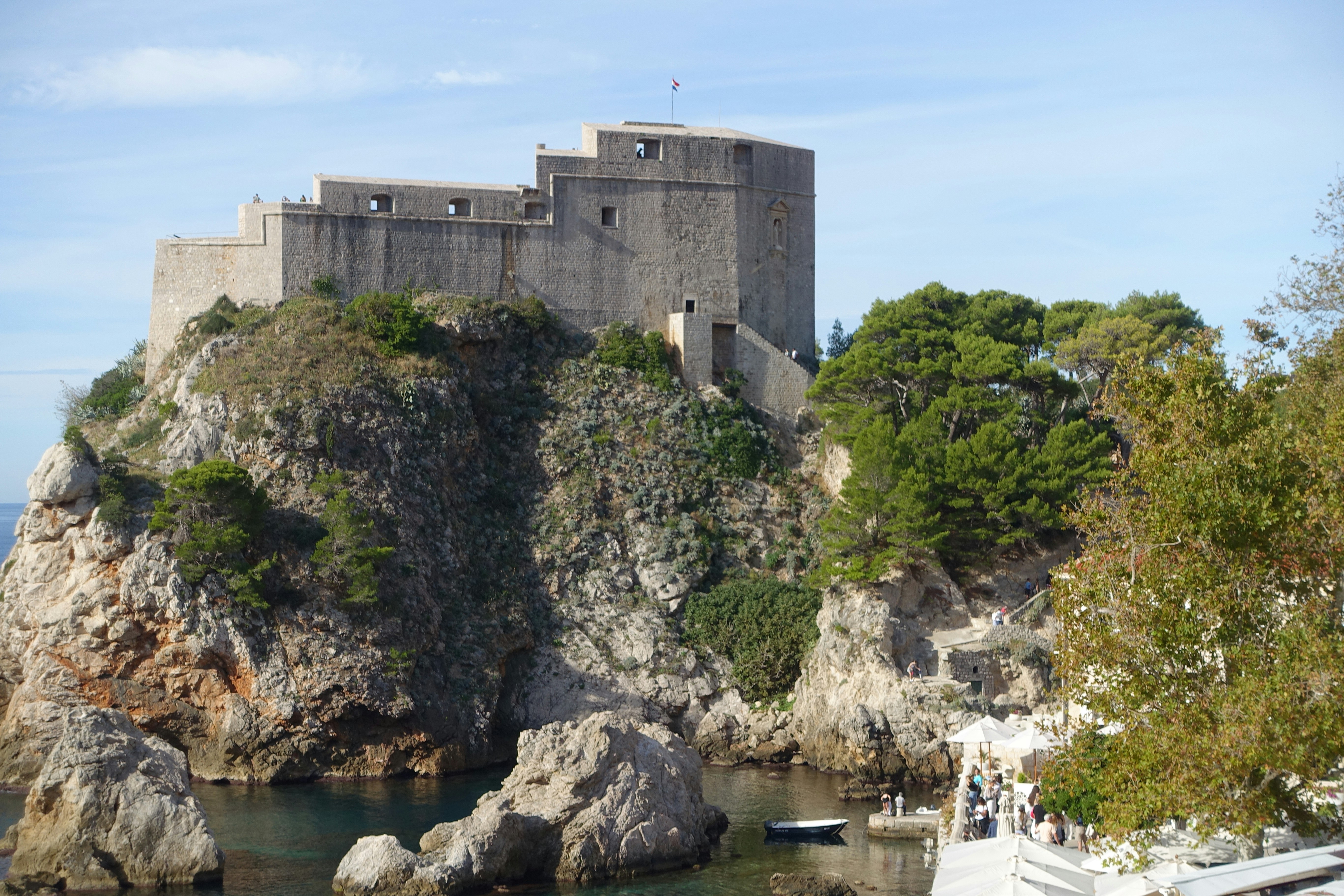 A castle on a cliff with Lovrijenac in the background photo – Free ...