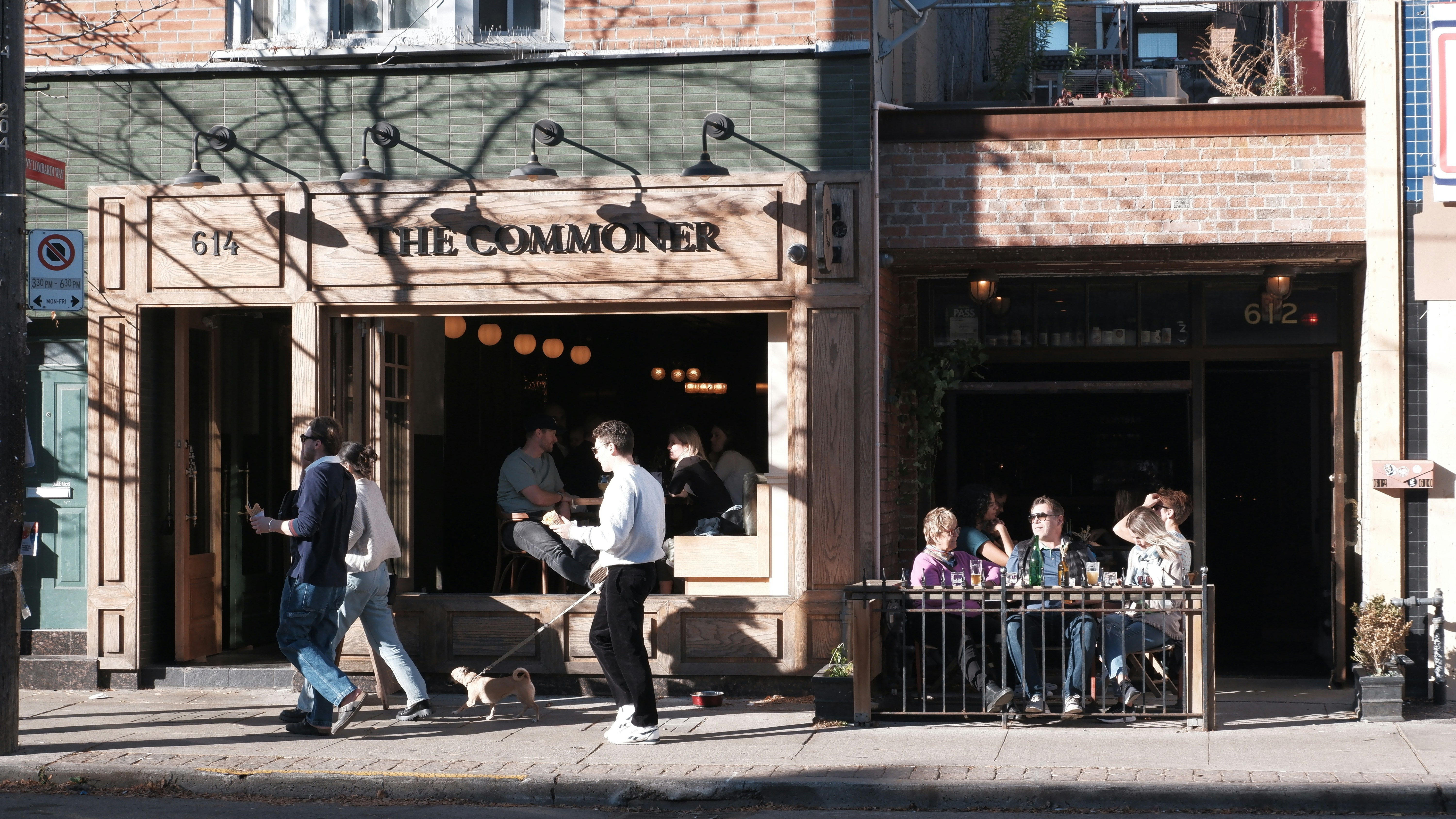 A group of people walking out of a restaurant photo – Free Toronto ...