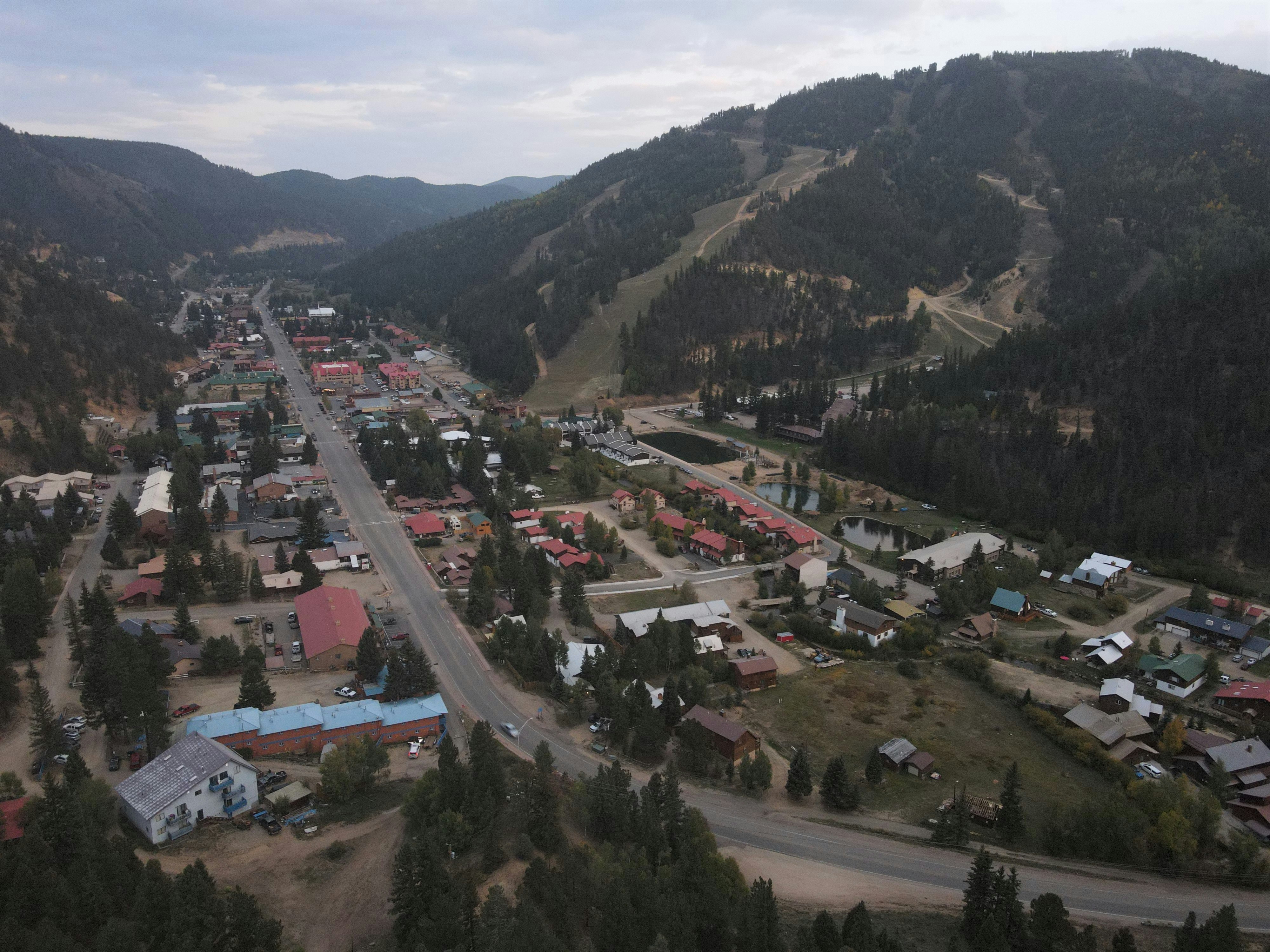 Mountain Town Aerial: A Quiet Switchback Spine Through the Valley