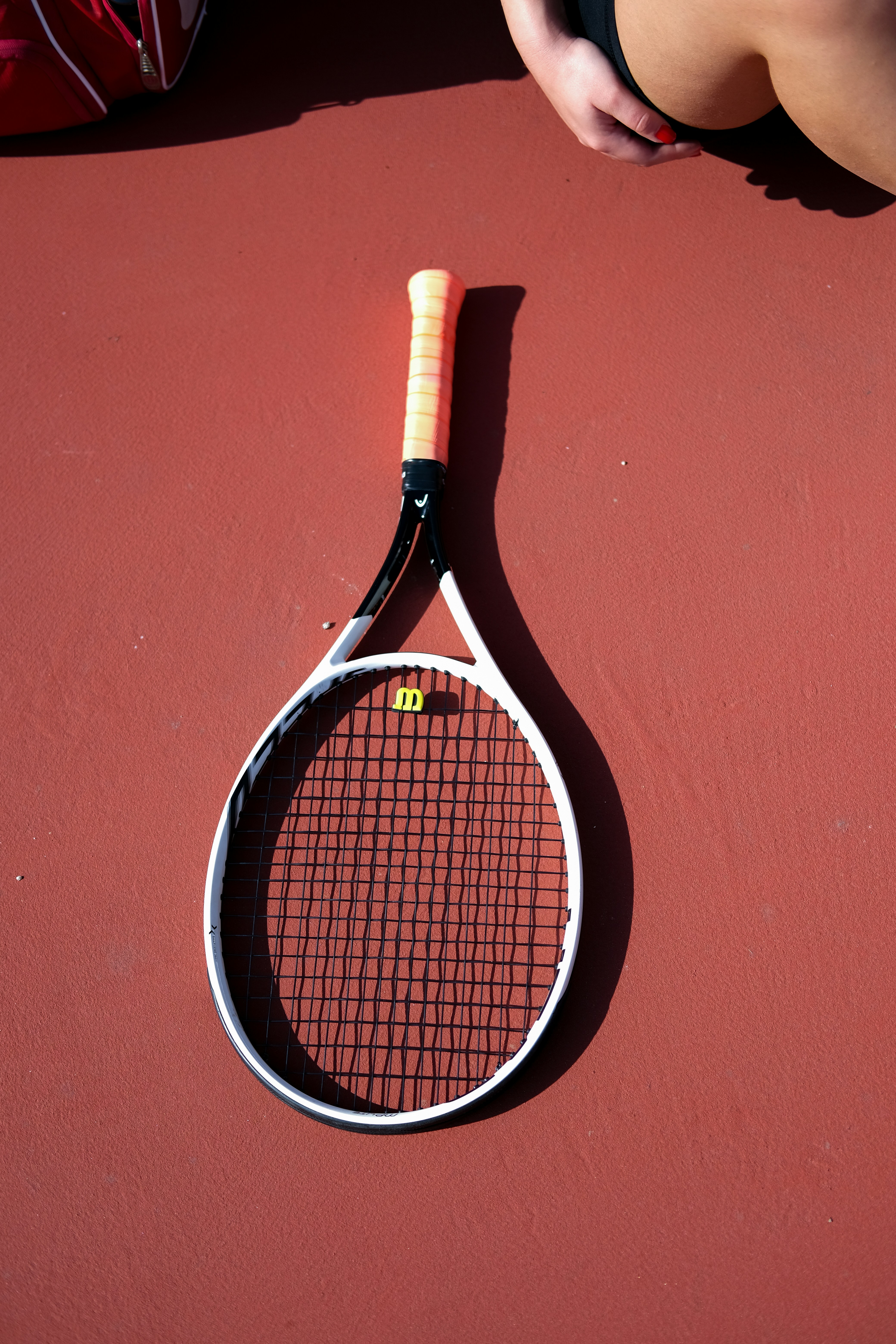A tennis racket on a red carpet photo – Free Racket Image on Unsplash