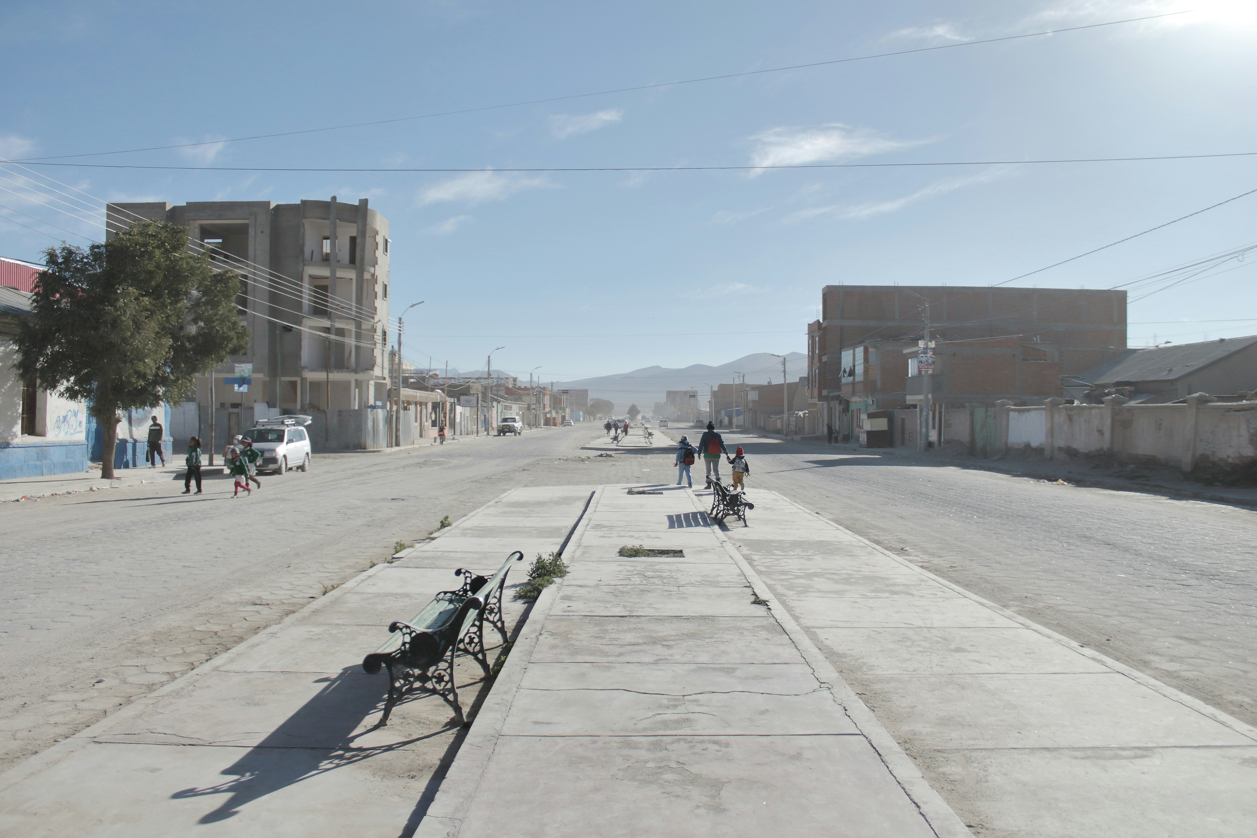 Vanishing Lines on a Sunlit City Promenade
