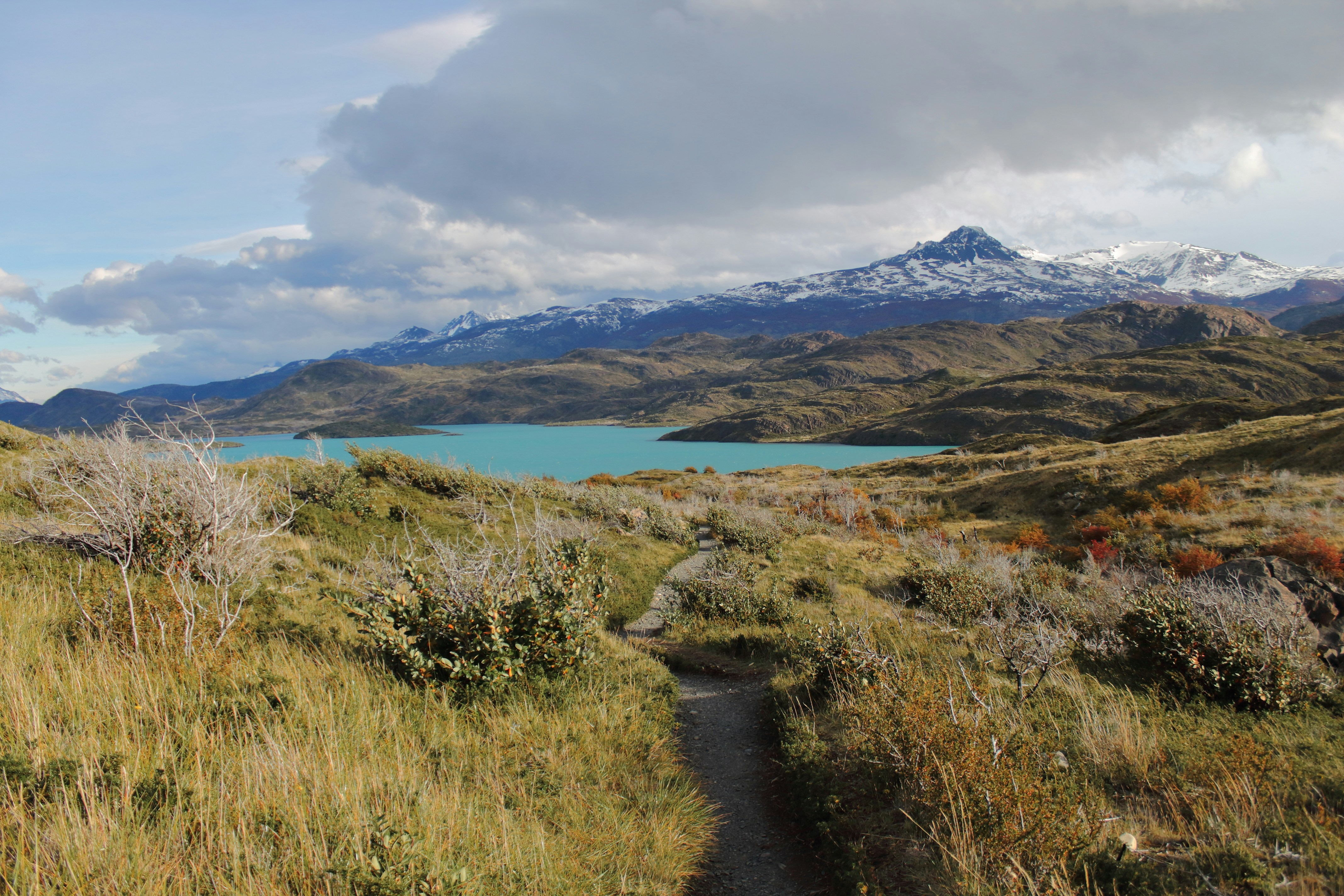 Trail to a Turquoise Lake Framed by Snow-dusted Peaks