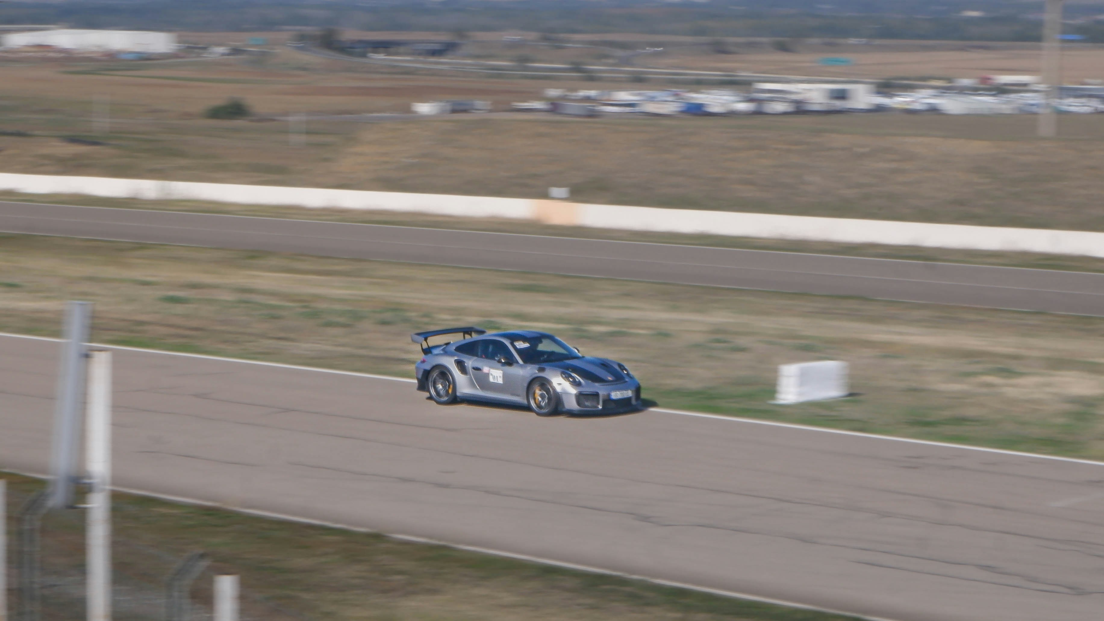 A car driving on a race track photo – Free Rustavi Image on Unsplash