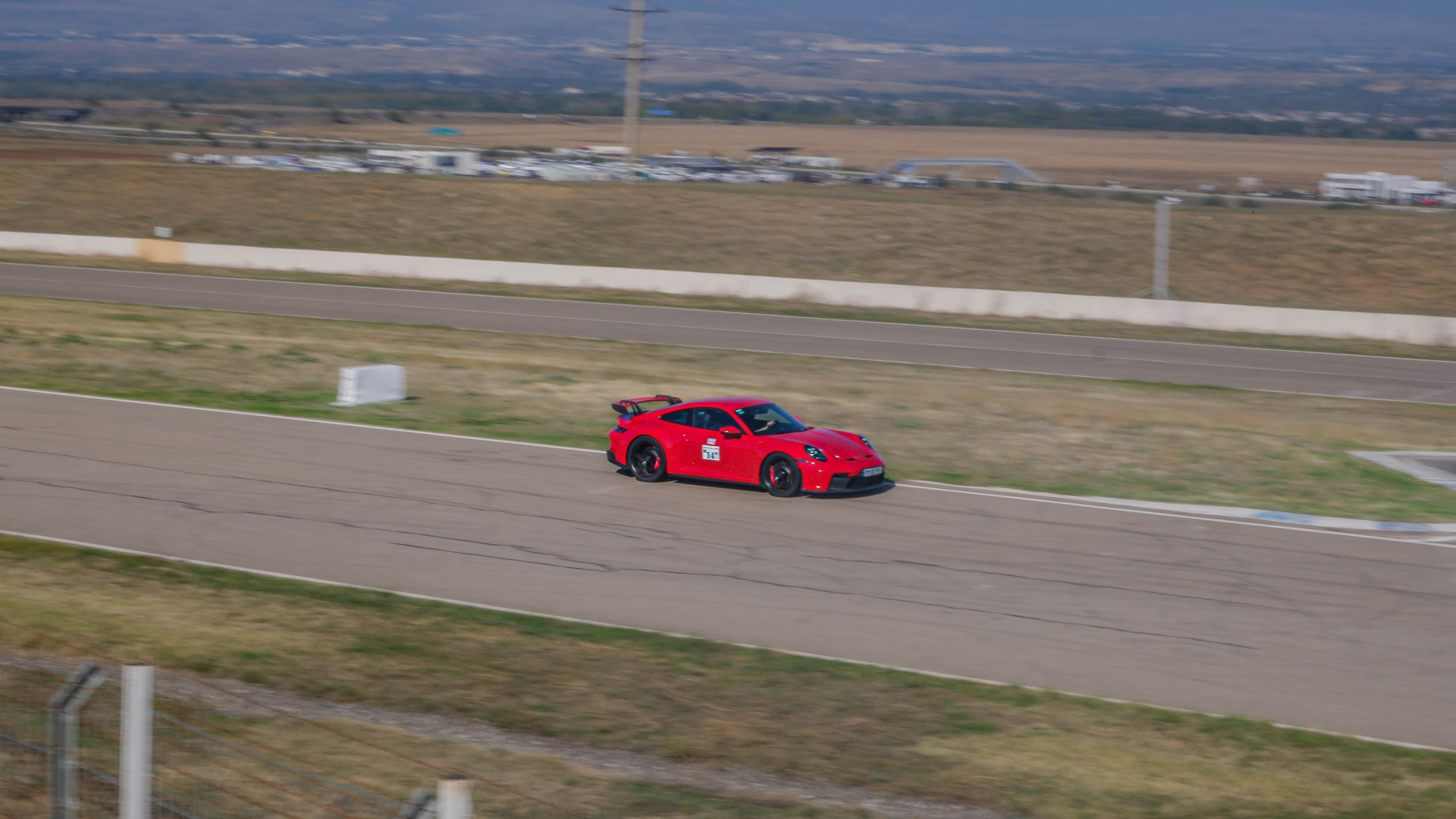 A red race car on a track photo – Free Rustavi Image on Unsplash
