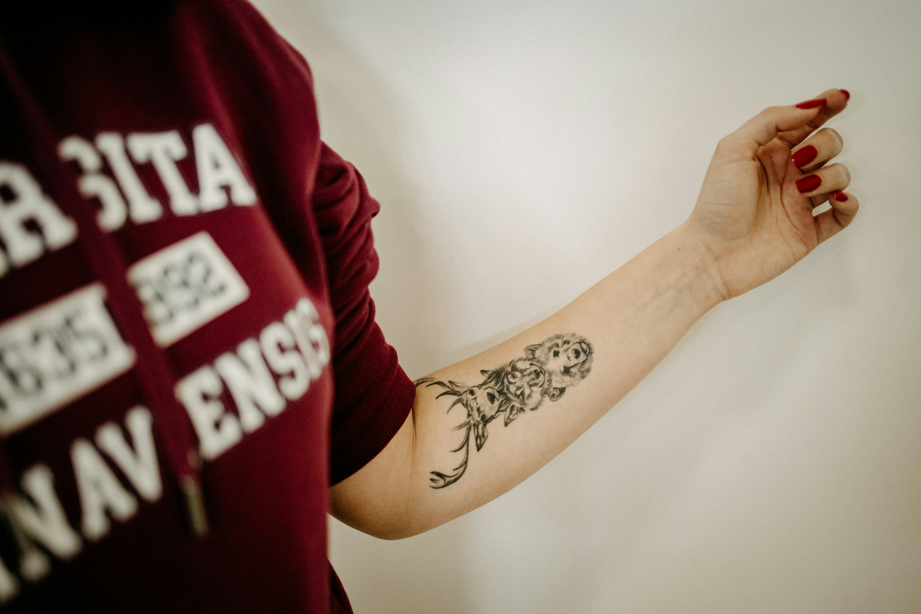 Tiny Dragon on the Forearm: Inked Detail in Soft Focus