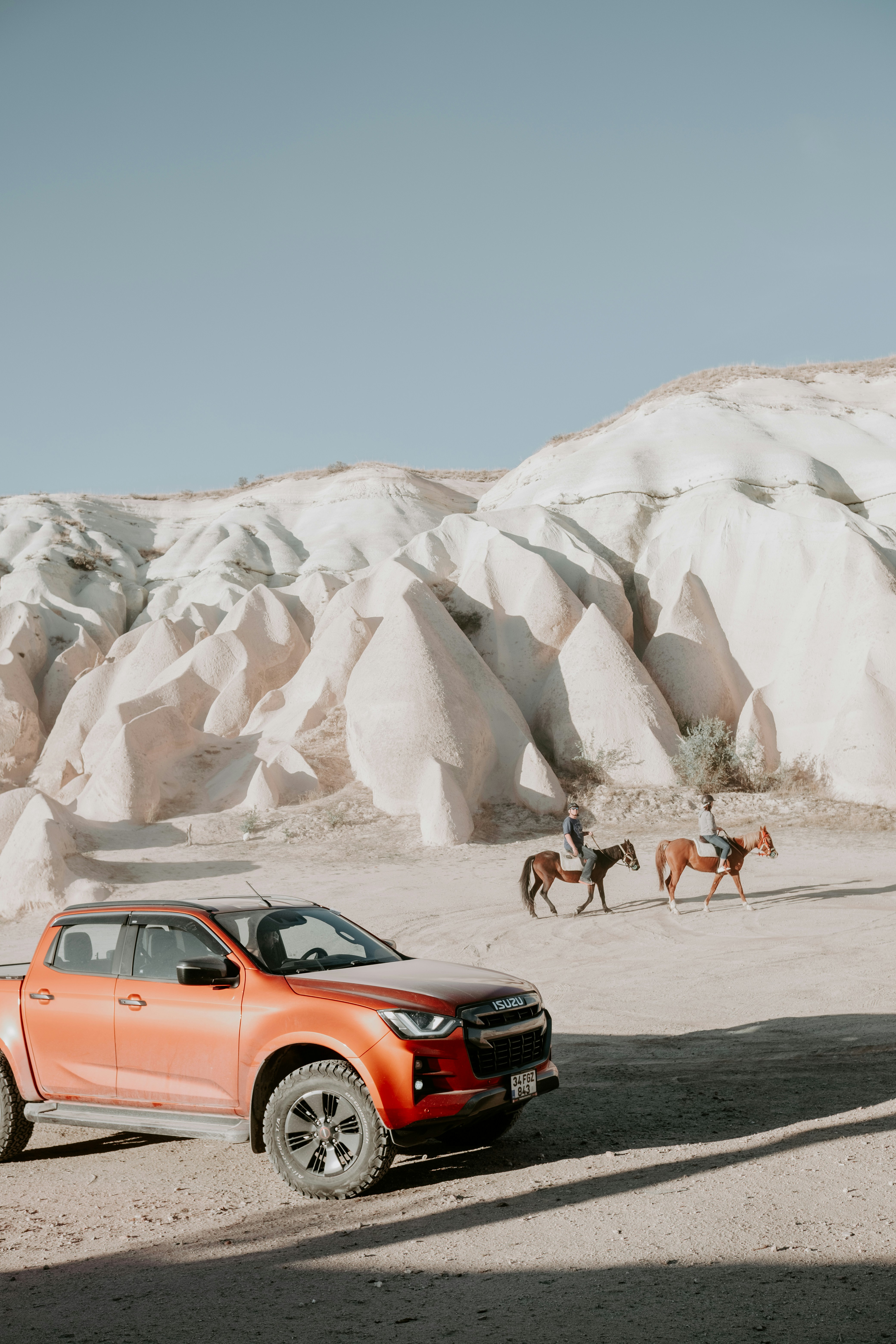 Dusty dunes and a bold orange rover