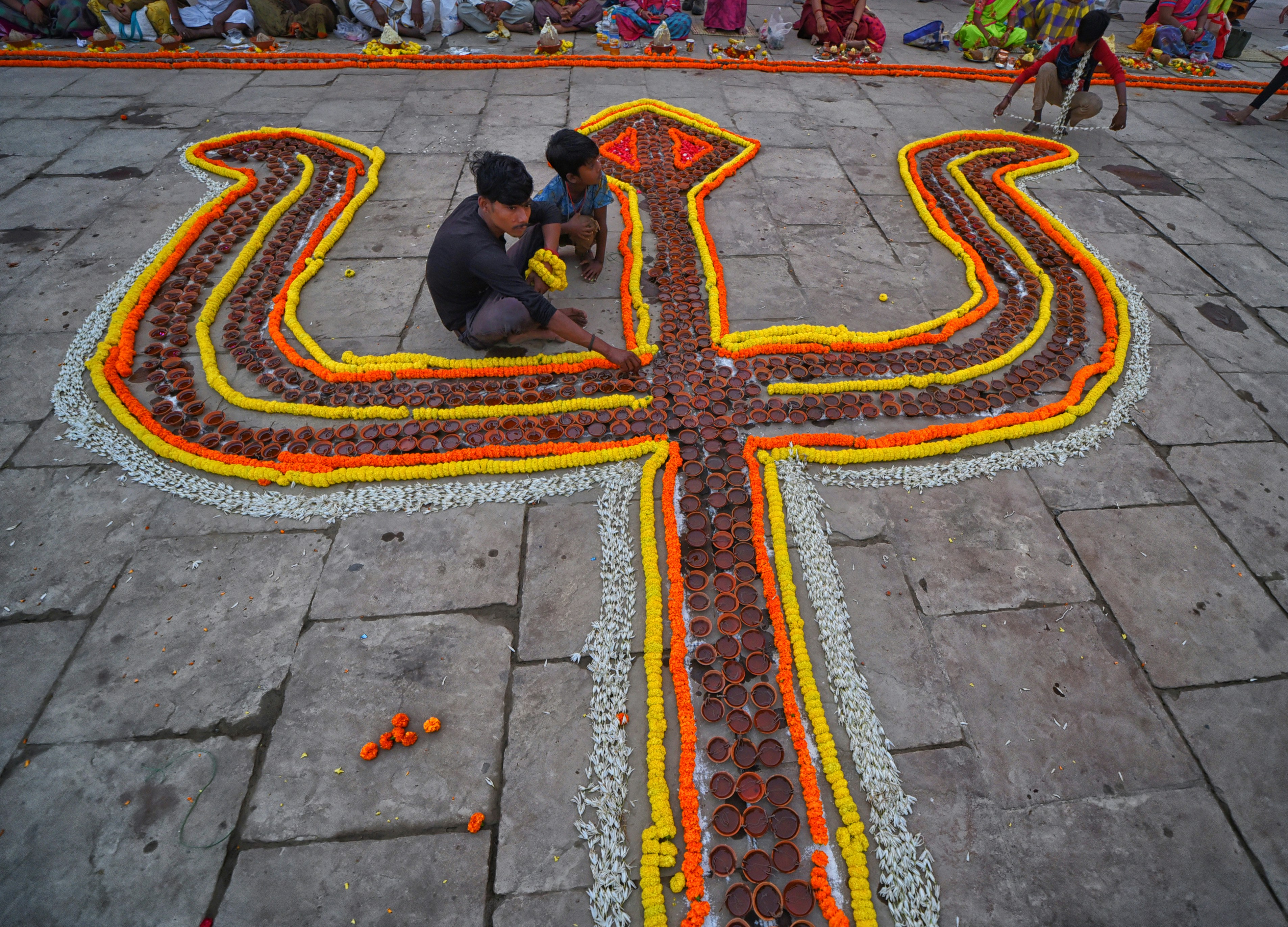 Petal Crosswork: A Festival Rangoli Unfolding on Stone