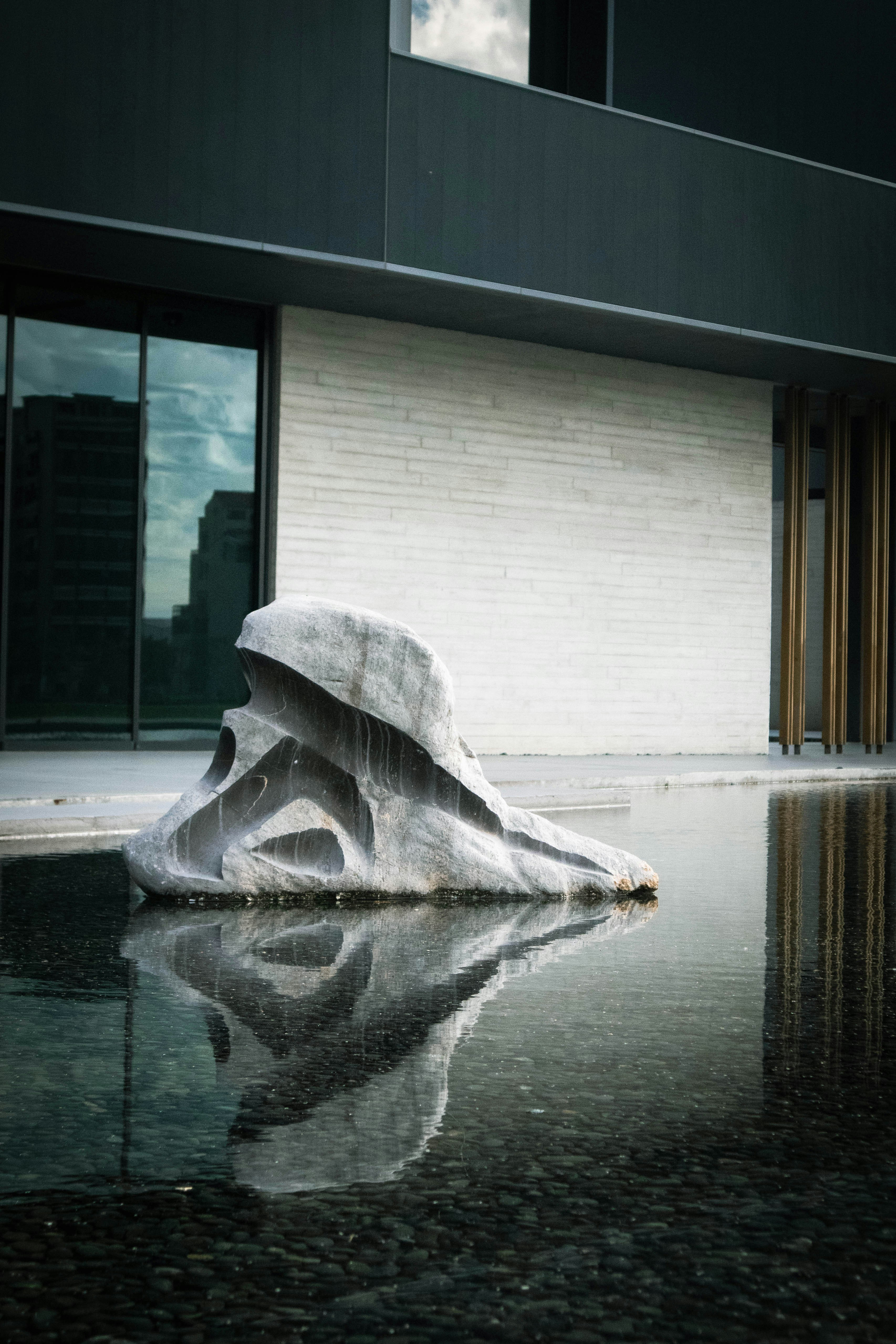 A large ice cube in a pool of water photo – Free Image on Unsplash