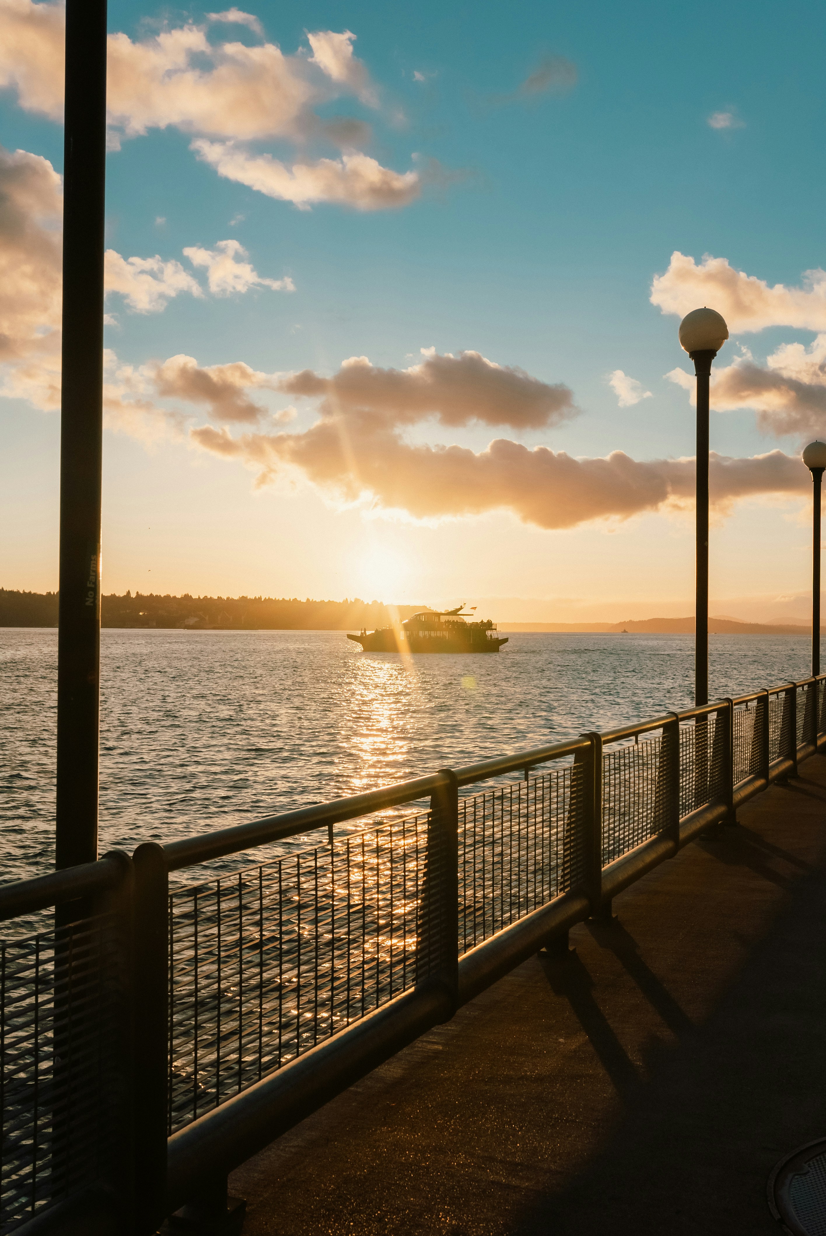 A body of water with a railing and a boat in it photo – Free Seattle ...