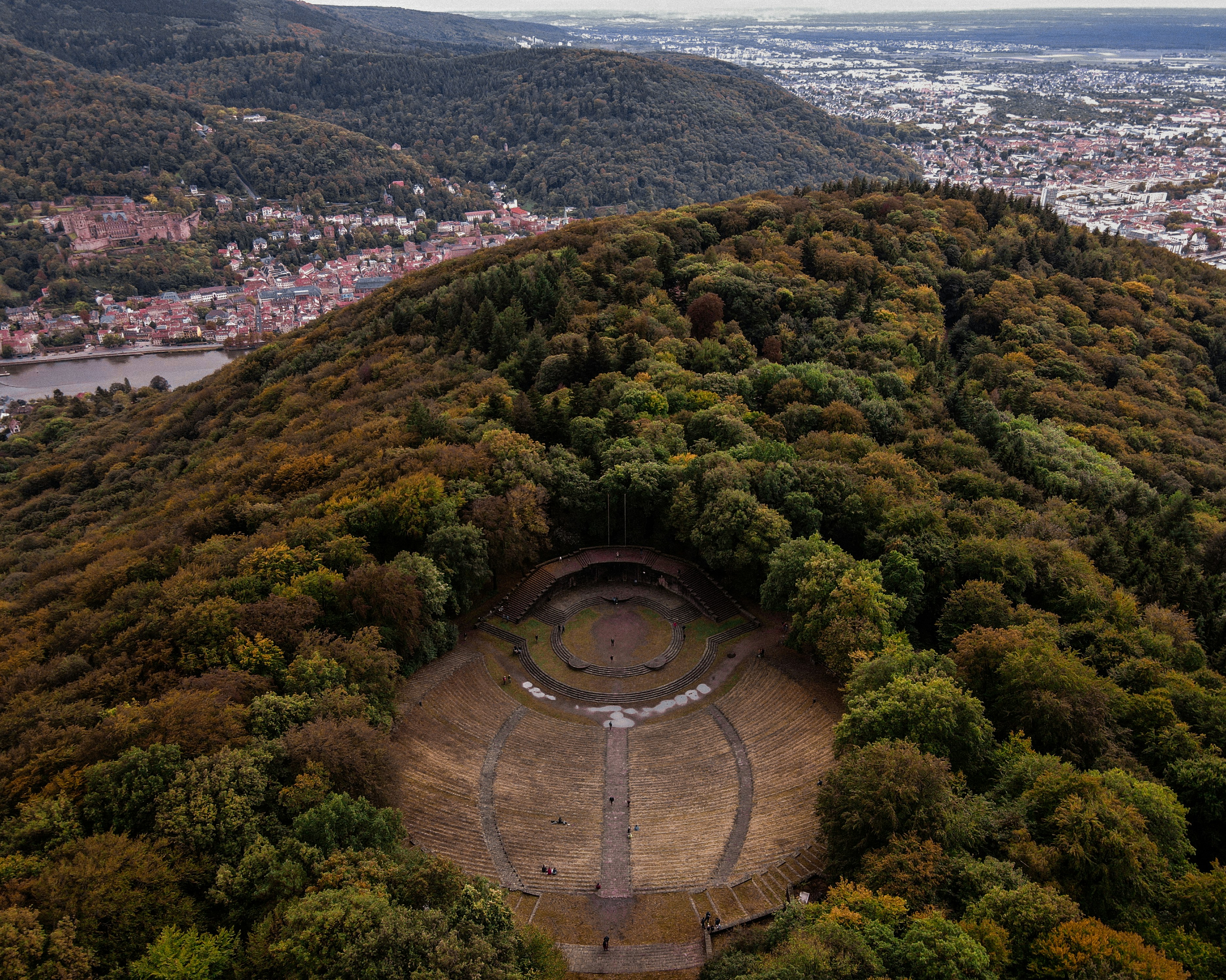 Ringed Terrace in Autumn Forest: A Drone View of Circular Paths on a Hill