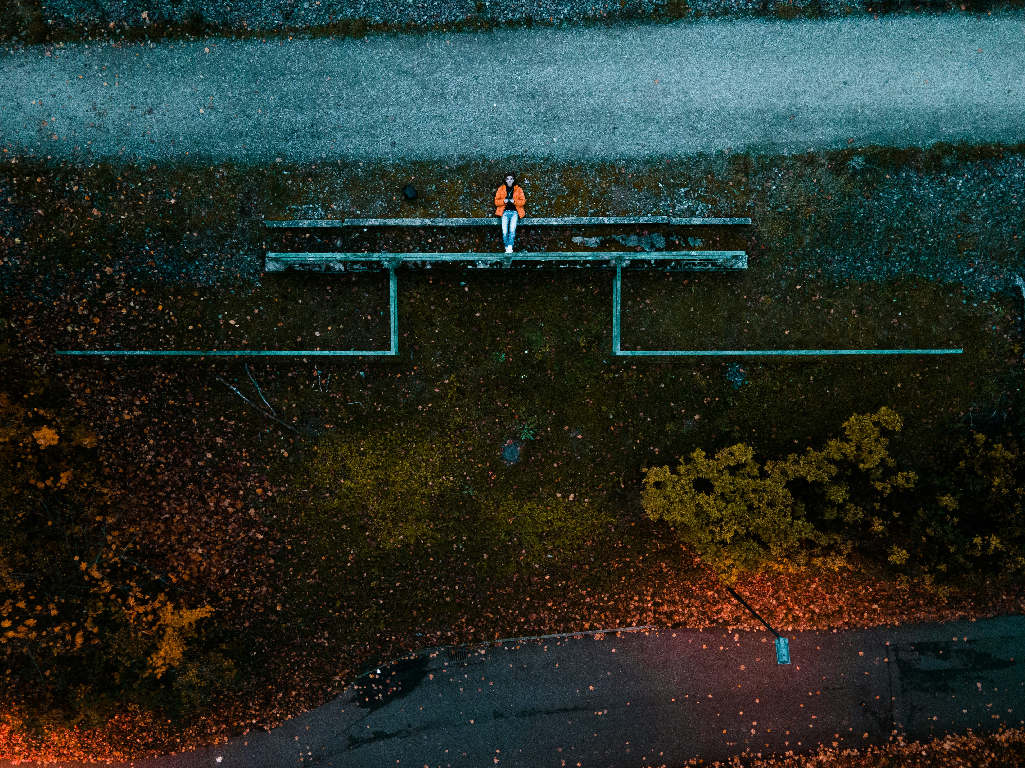 Lone Figure on a Distant Pier: Quiet Moment Over the Tidal Edge